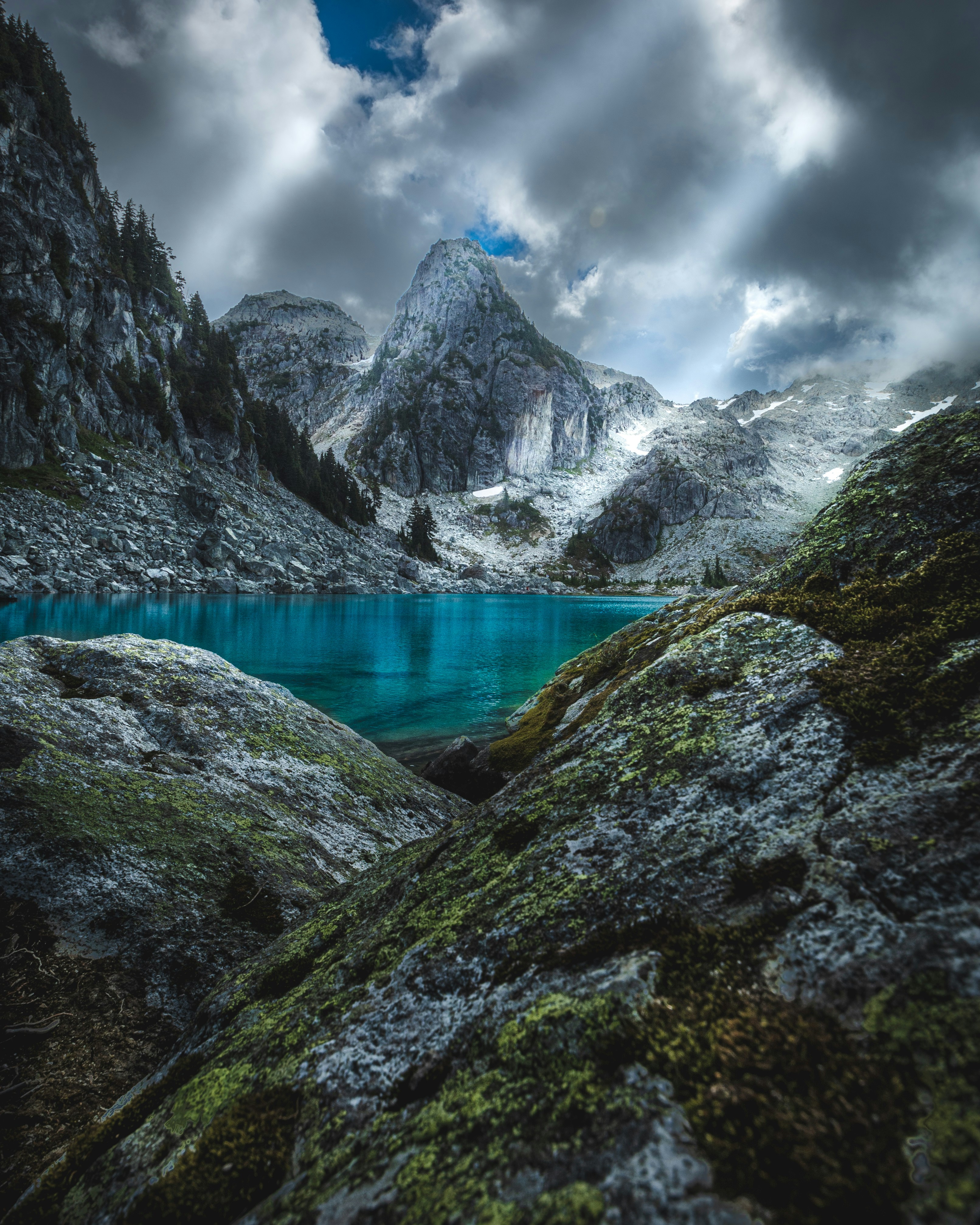 Azure Mirror: A Turquoise Mountain Lake Surrounded by Craggy Peaks