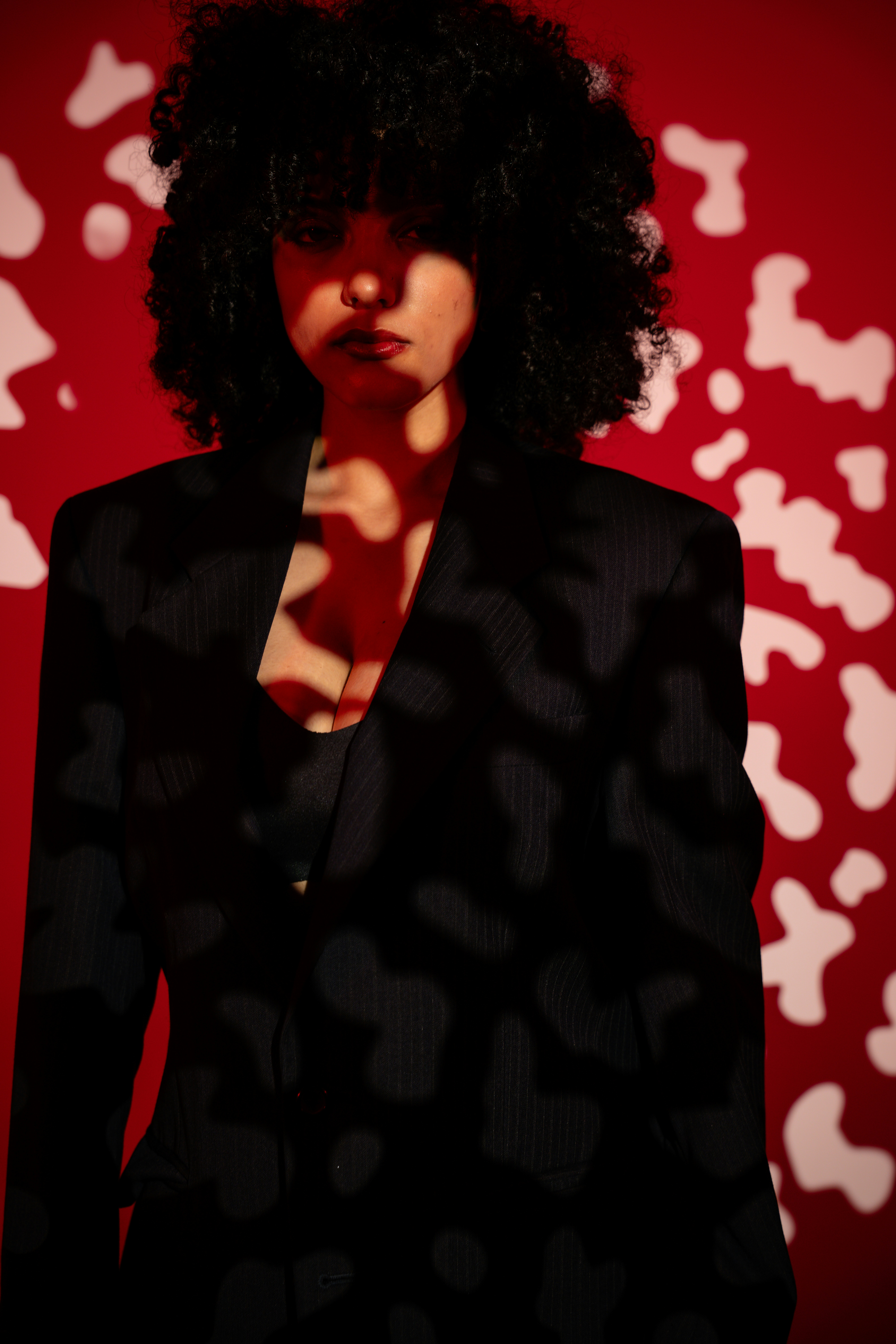 A woman poses with shadowy patterns. photo – Free Female model Image on ...