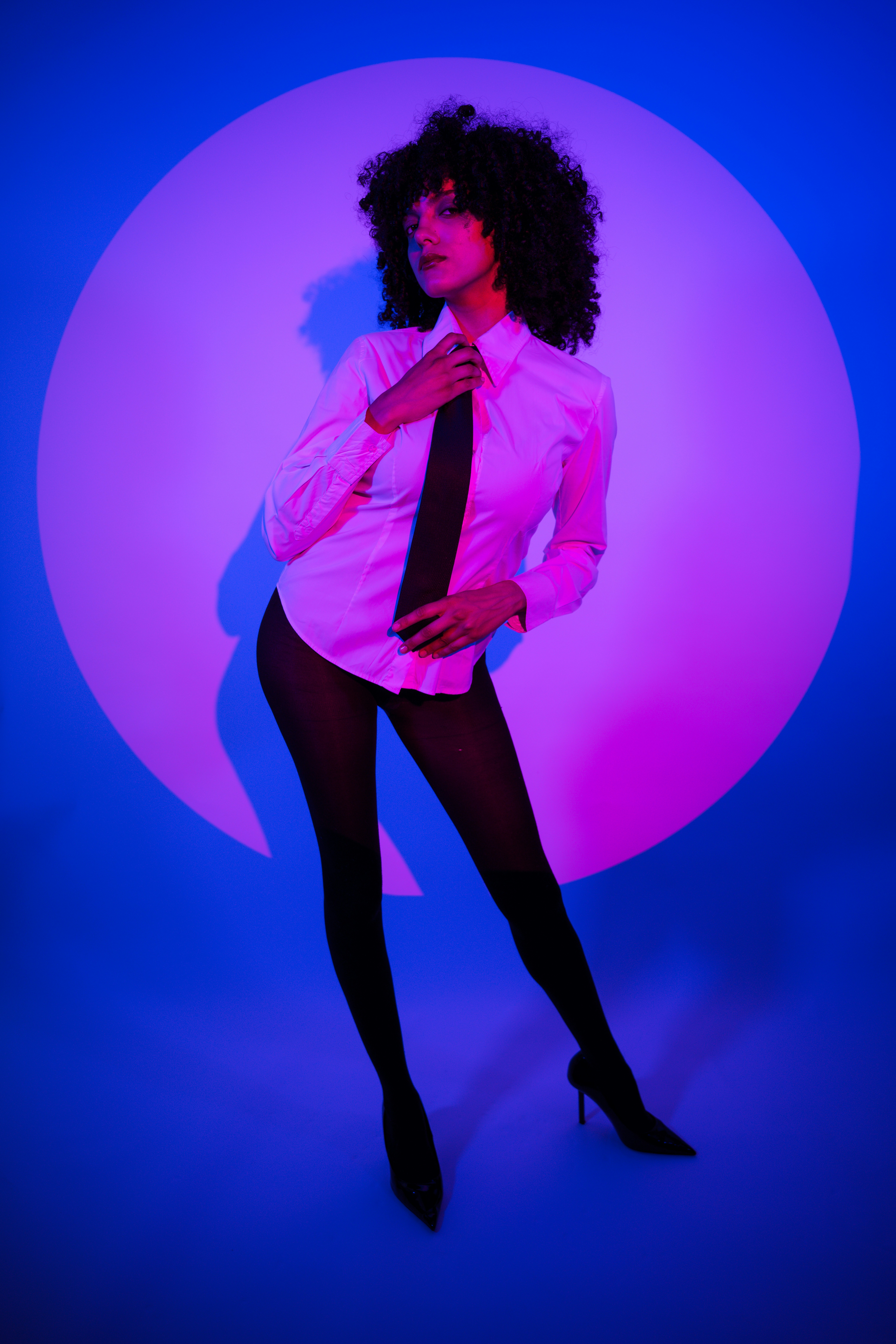 A woman poses in a fashionable, colorful shoot. photo – Free Female ...