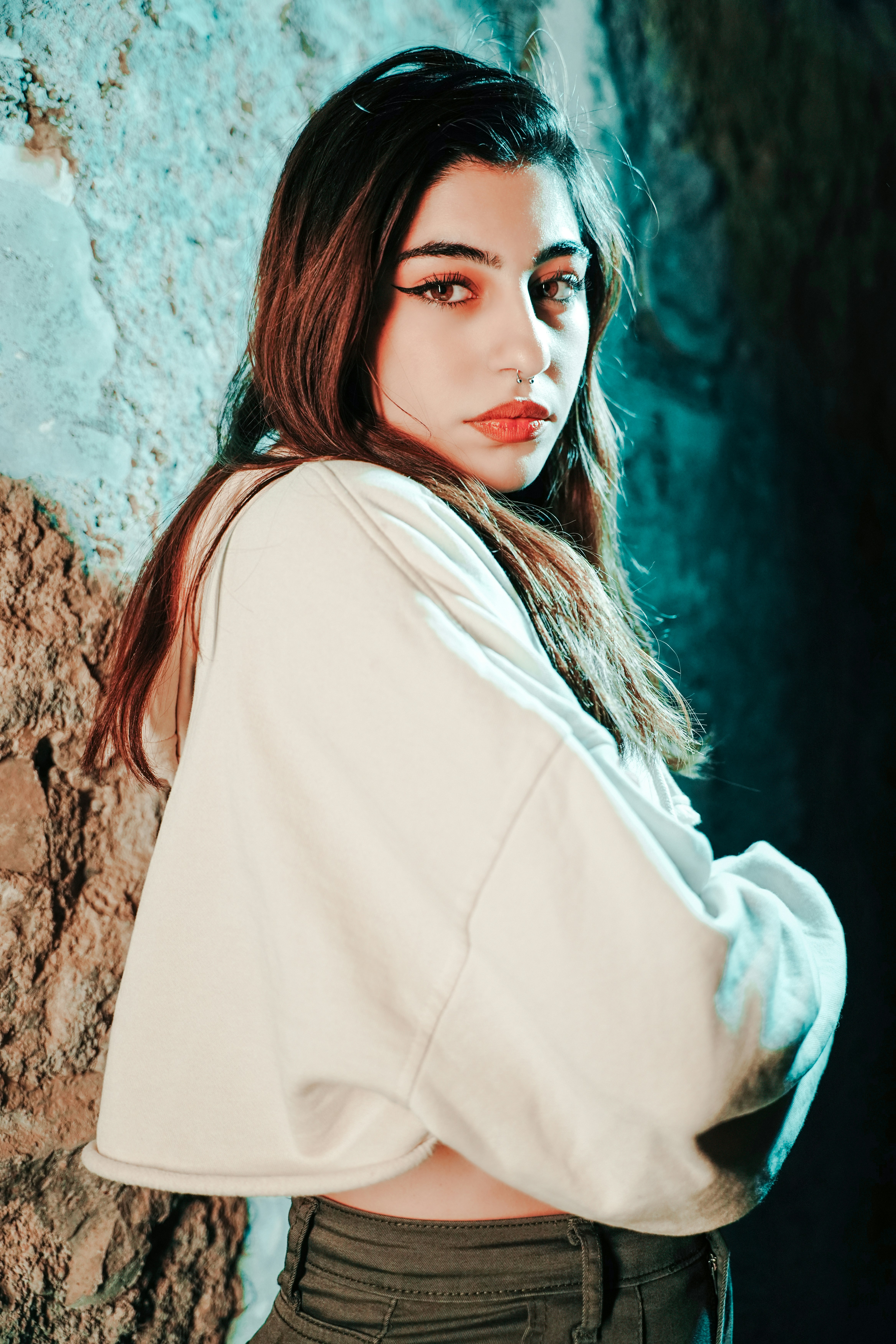 A woman gazes at the camera with a cool pose. photo – Free Woman Image ...