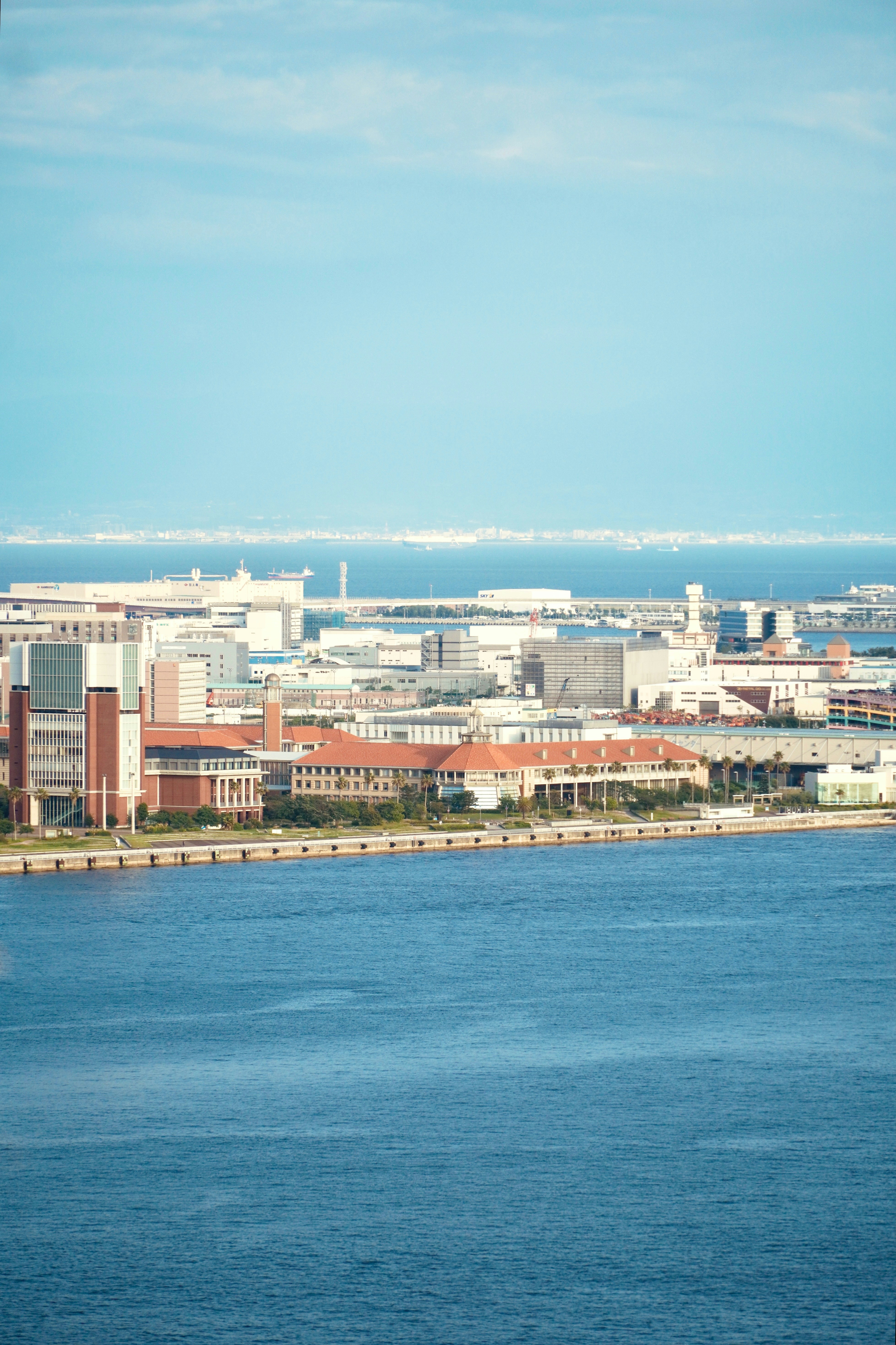 A city waterfront with buildings and water.