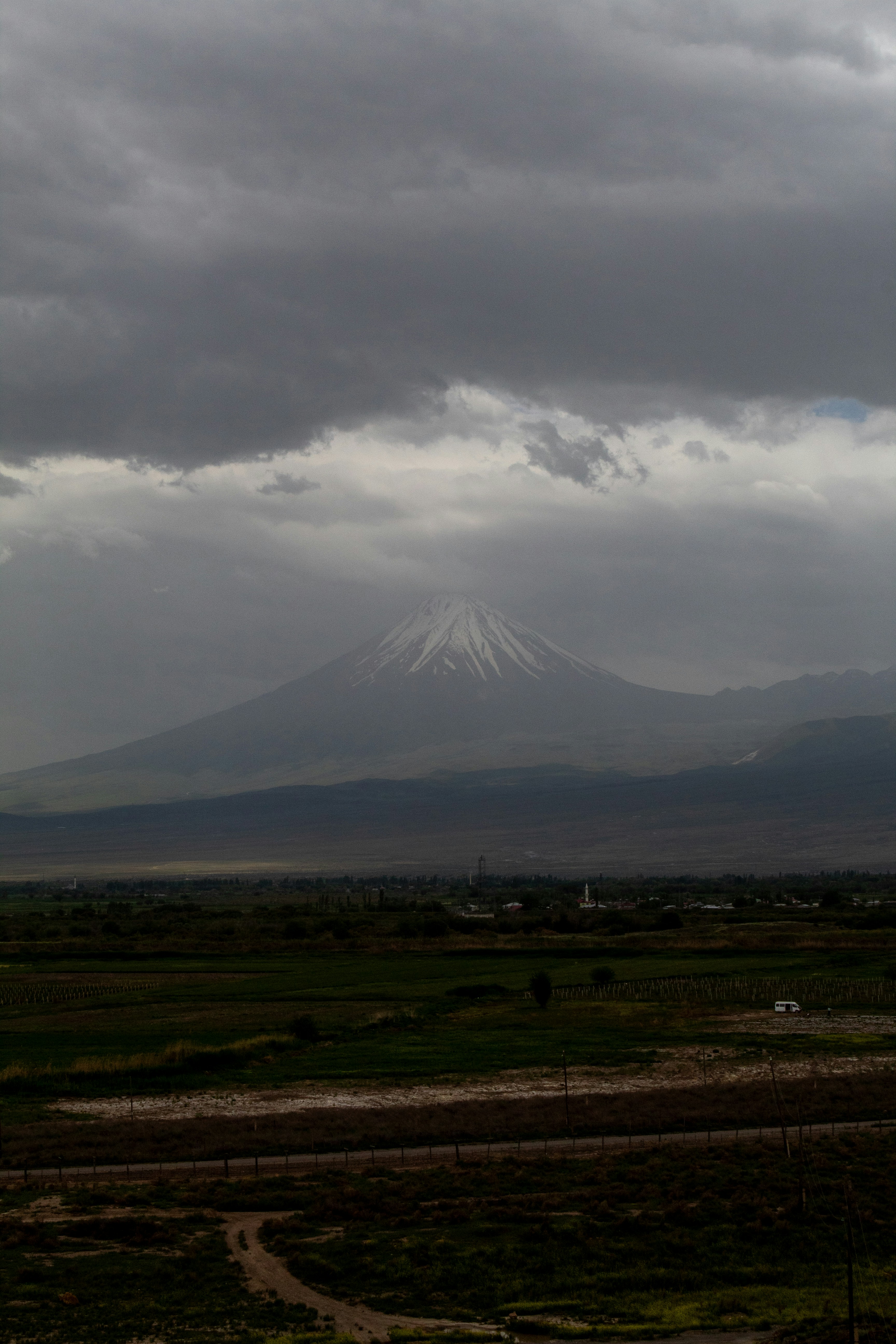 Veil of Clouds Over the Silent Giant