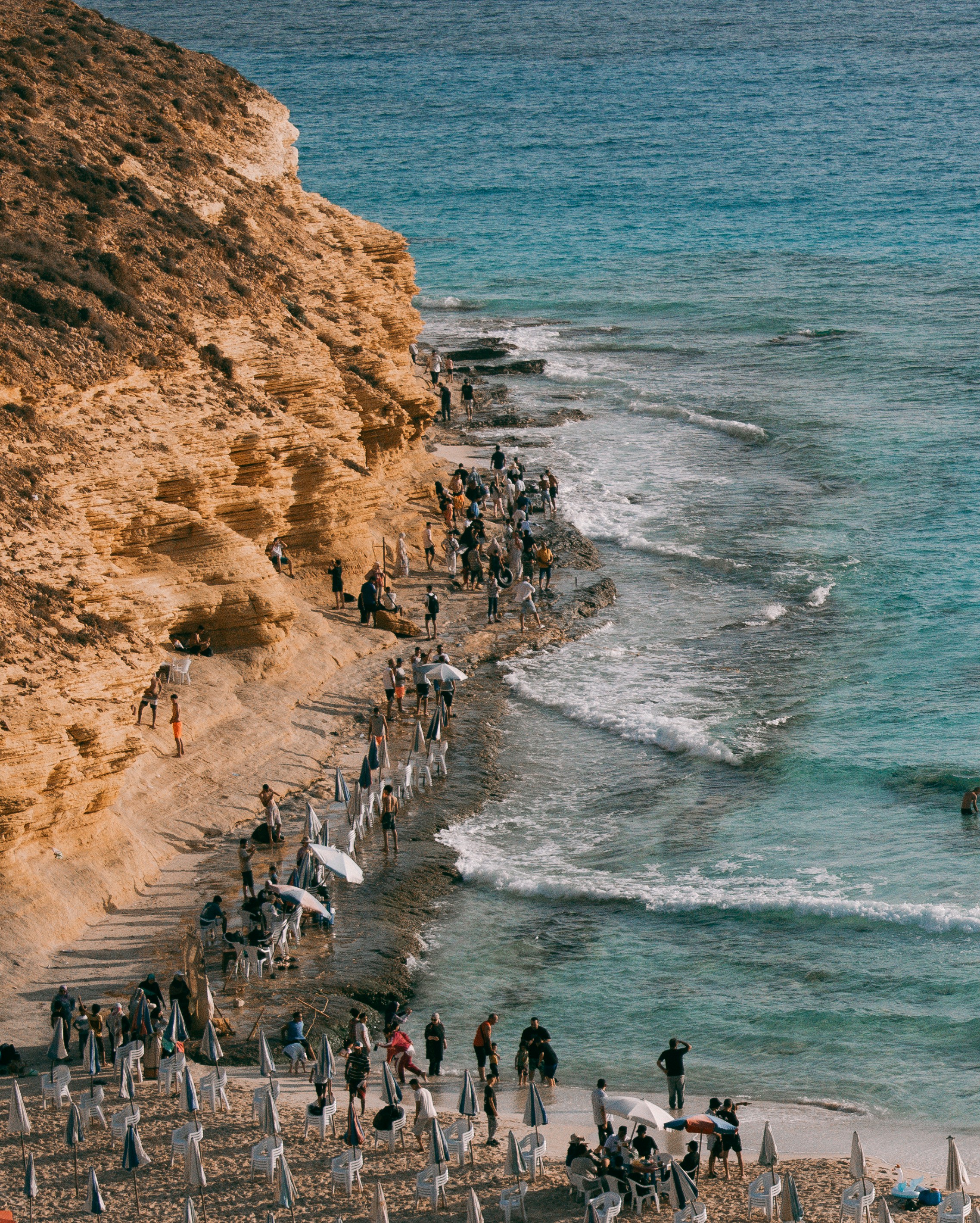 Footpath of the Cove: Cliffside Beachgoers Thread the Turquoise Shore