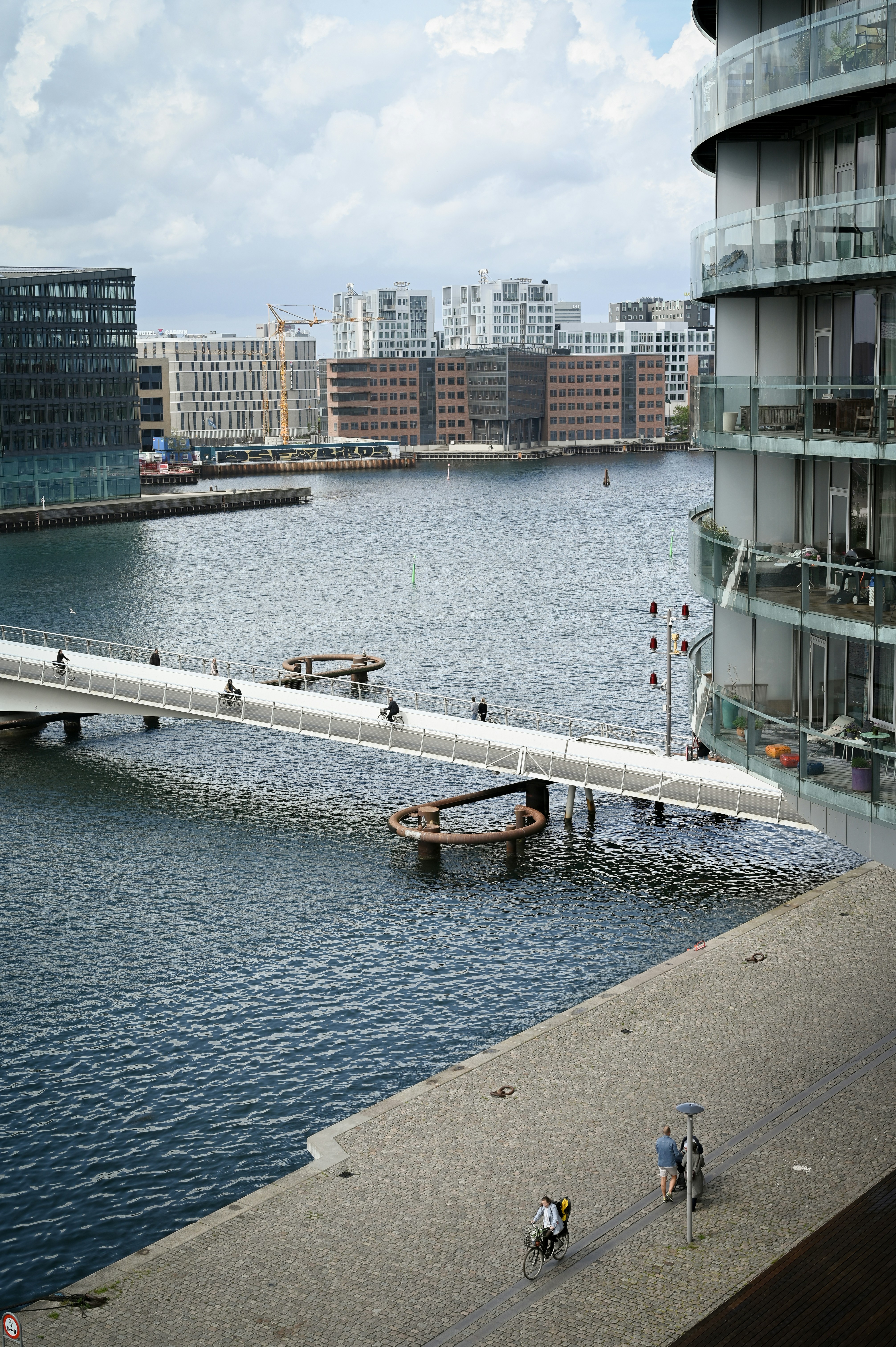 Cyclists crossing a bridge in Copenhagen.