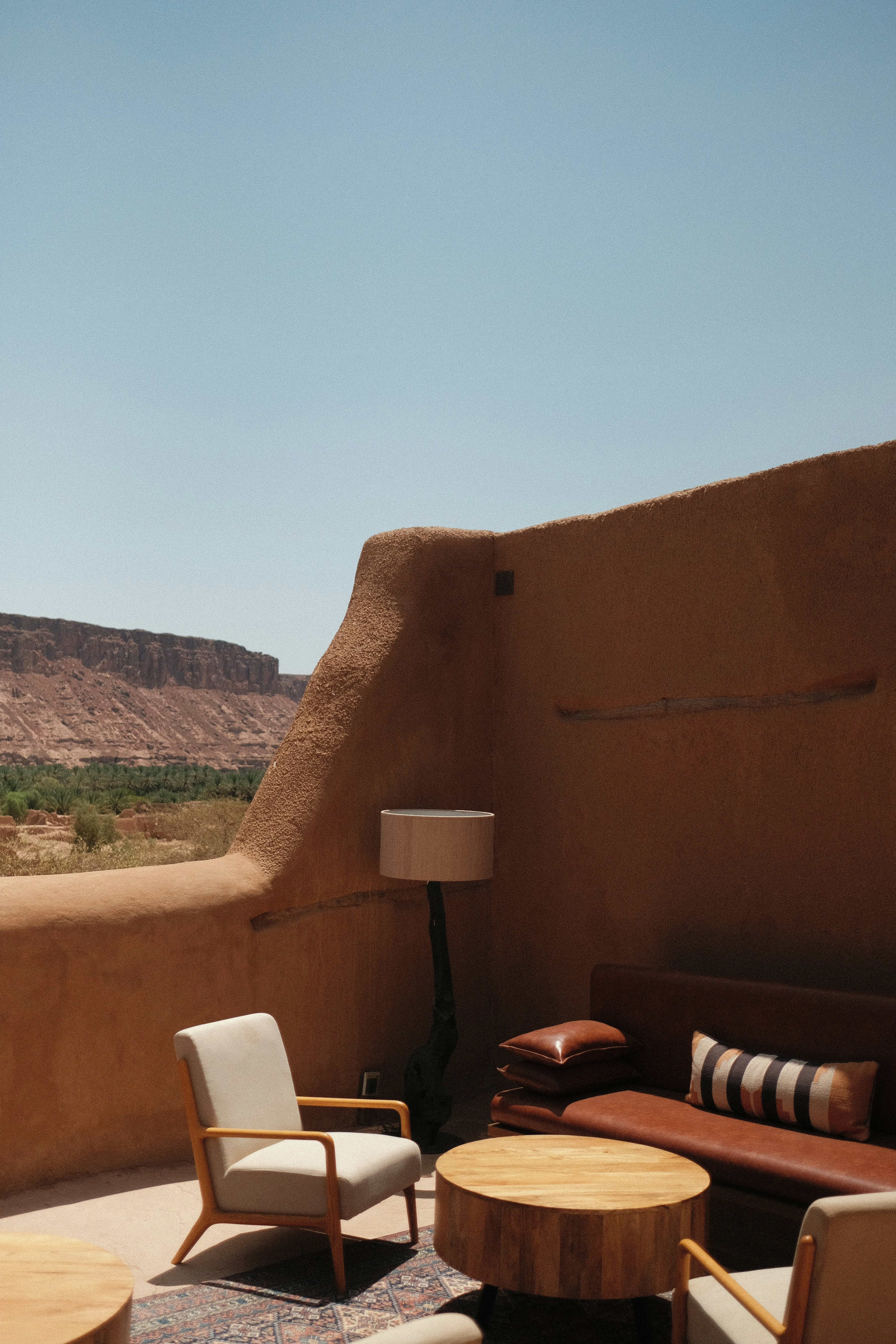 Adobe Terrace Lounge: Round Coffee Table Anchors a Desert-View Oasis