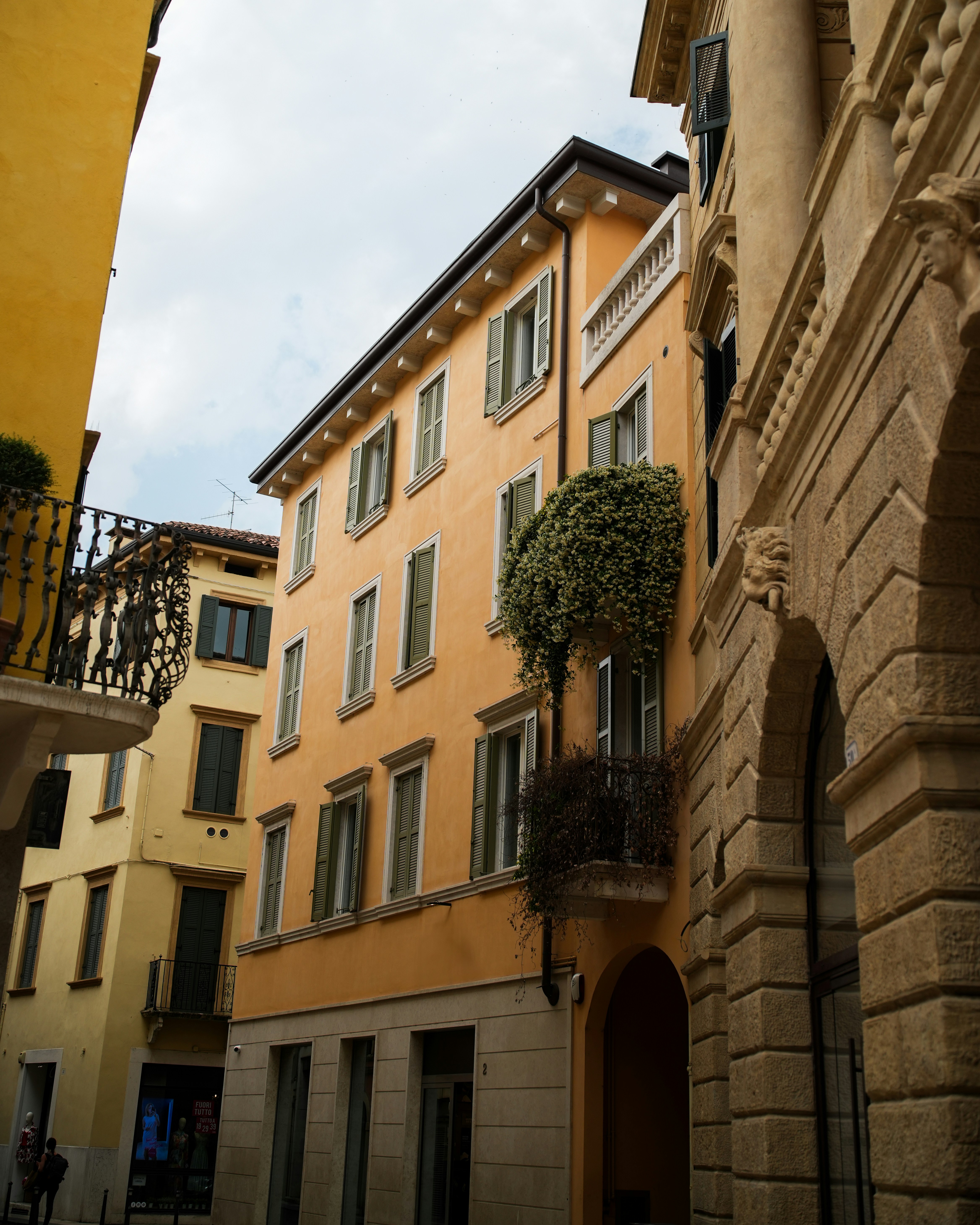 An alley with vintage buildings in Verona, Italy | Old buildings line a charming european street.
