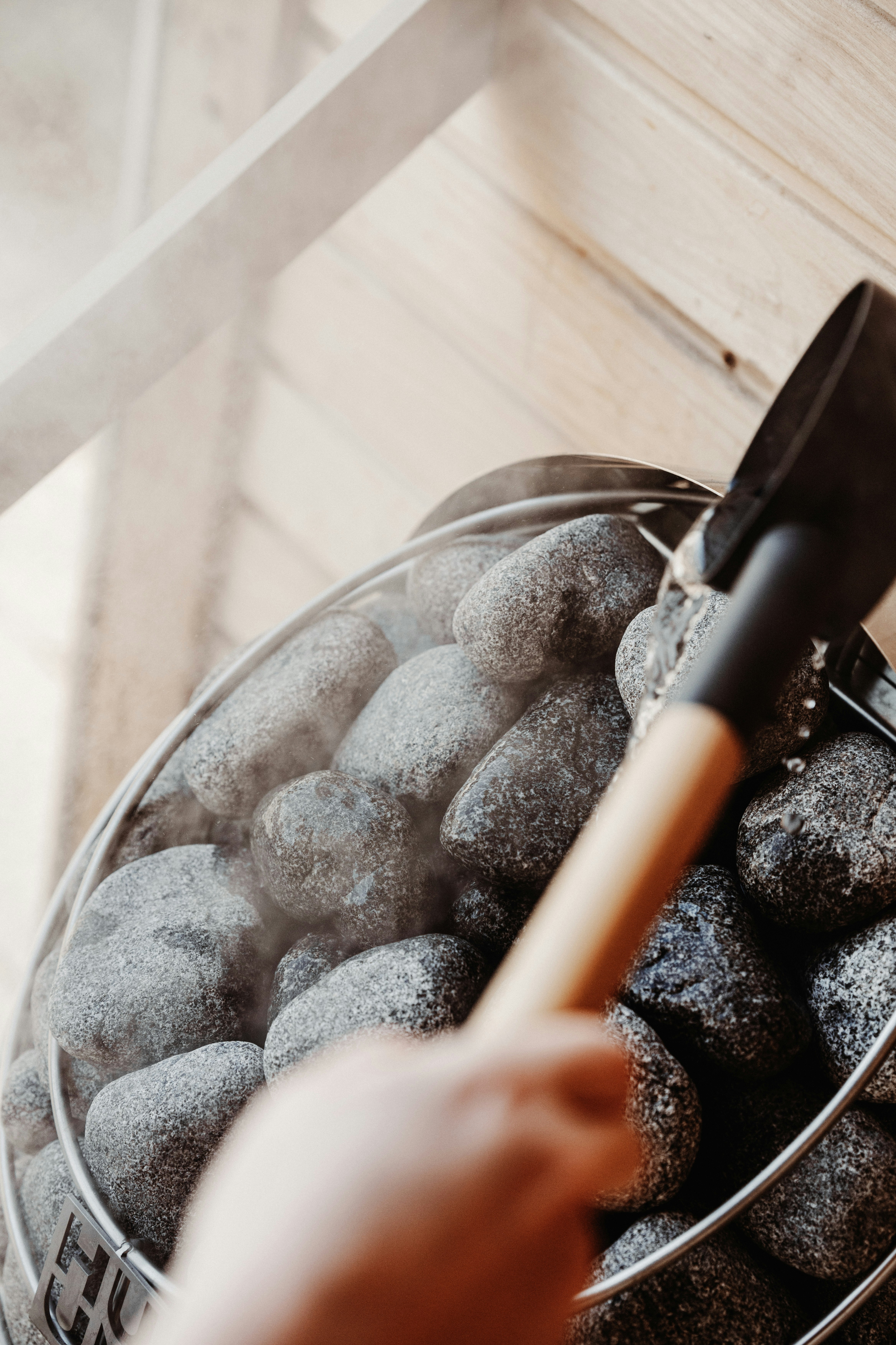 Someone is sprinkling water on sauna rocks. photo – Free Design Image ...