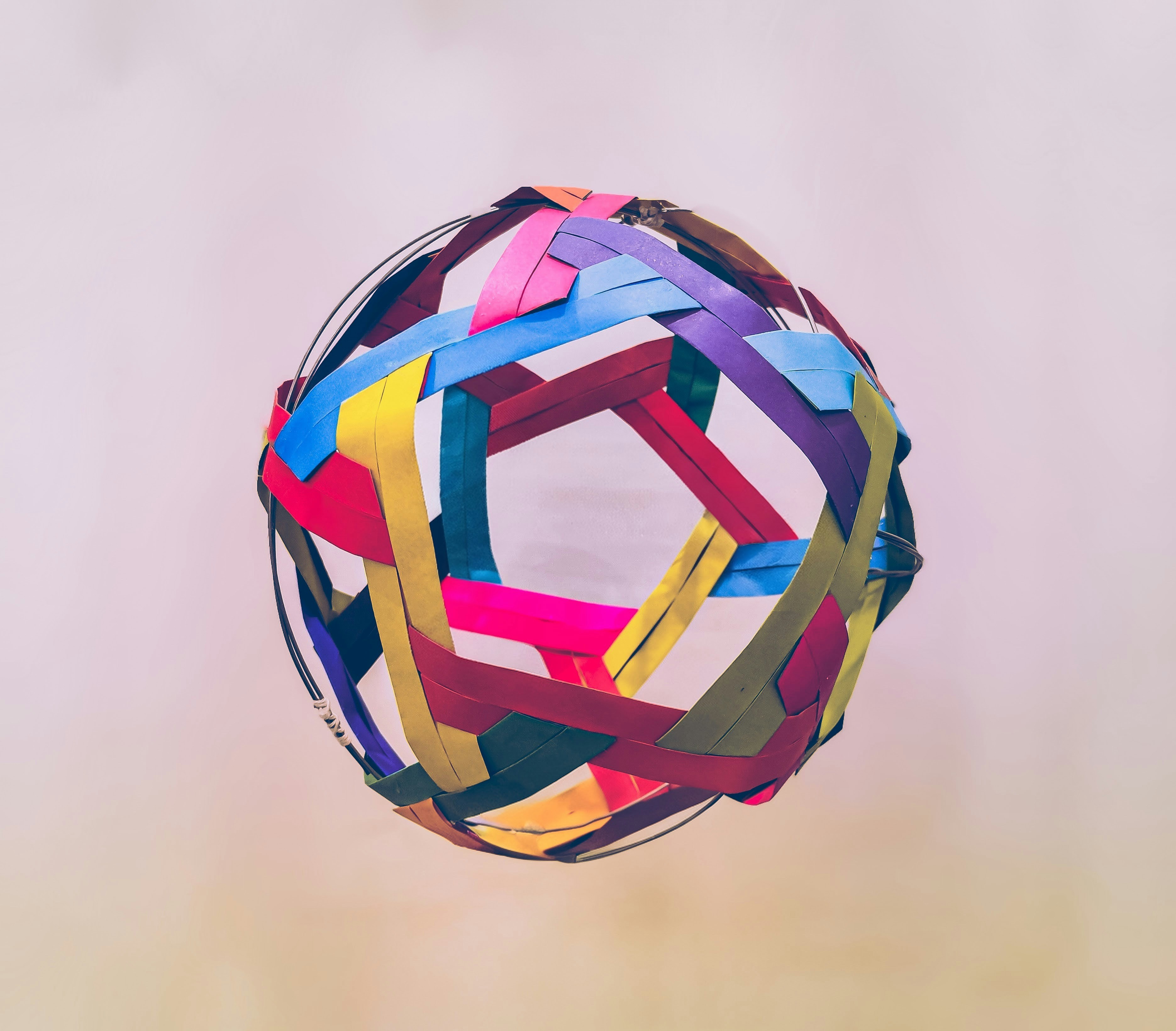 A colorful ball made of intertwined ribbons. photo – Free Art Image on ...