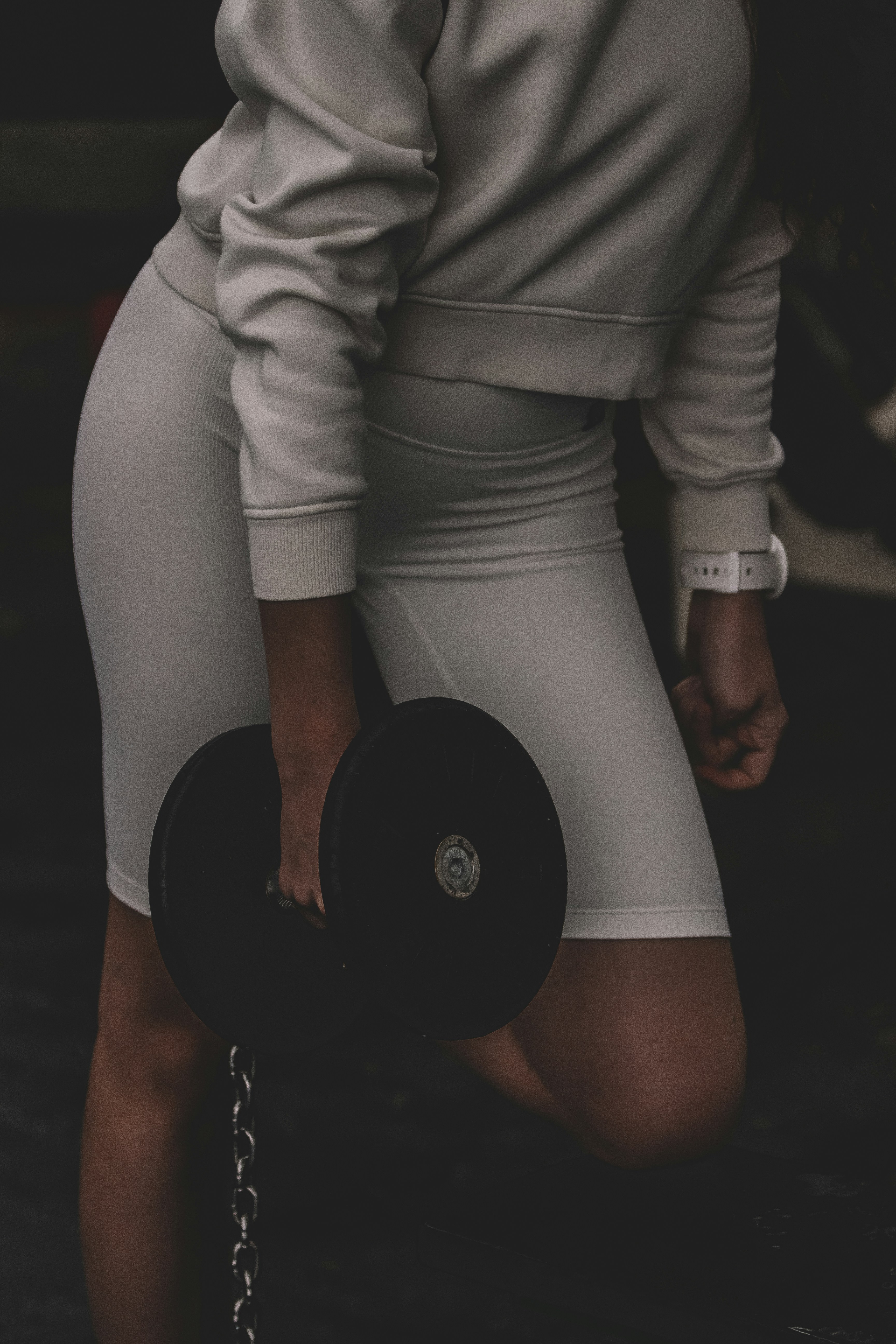 Saint Petersburg, Russia, 2025 | Woman is lifting weights.