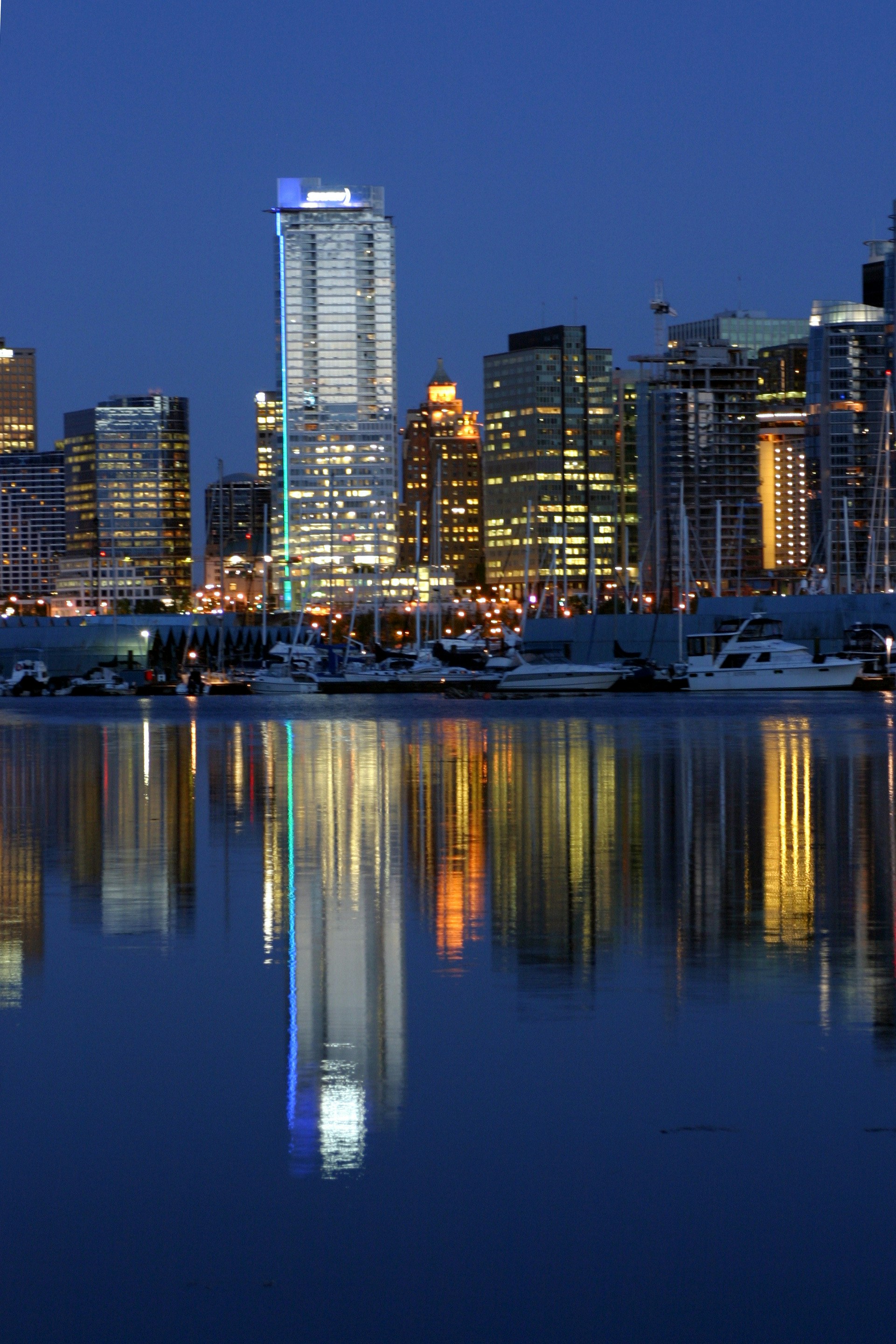 A beautiful nighttime skyline with reflecting waters.