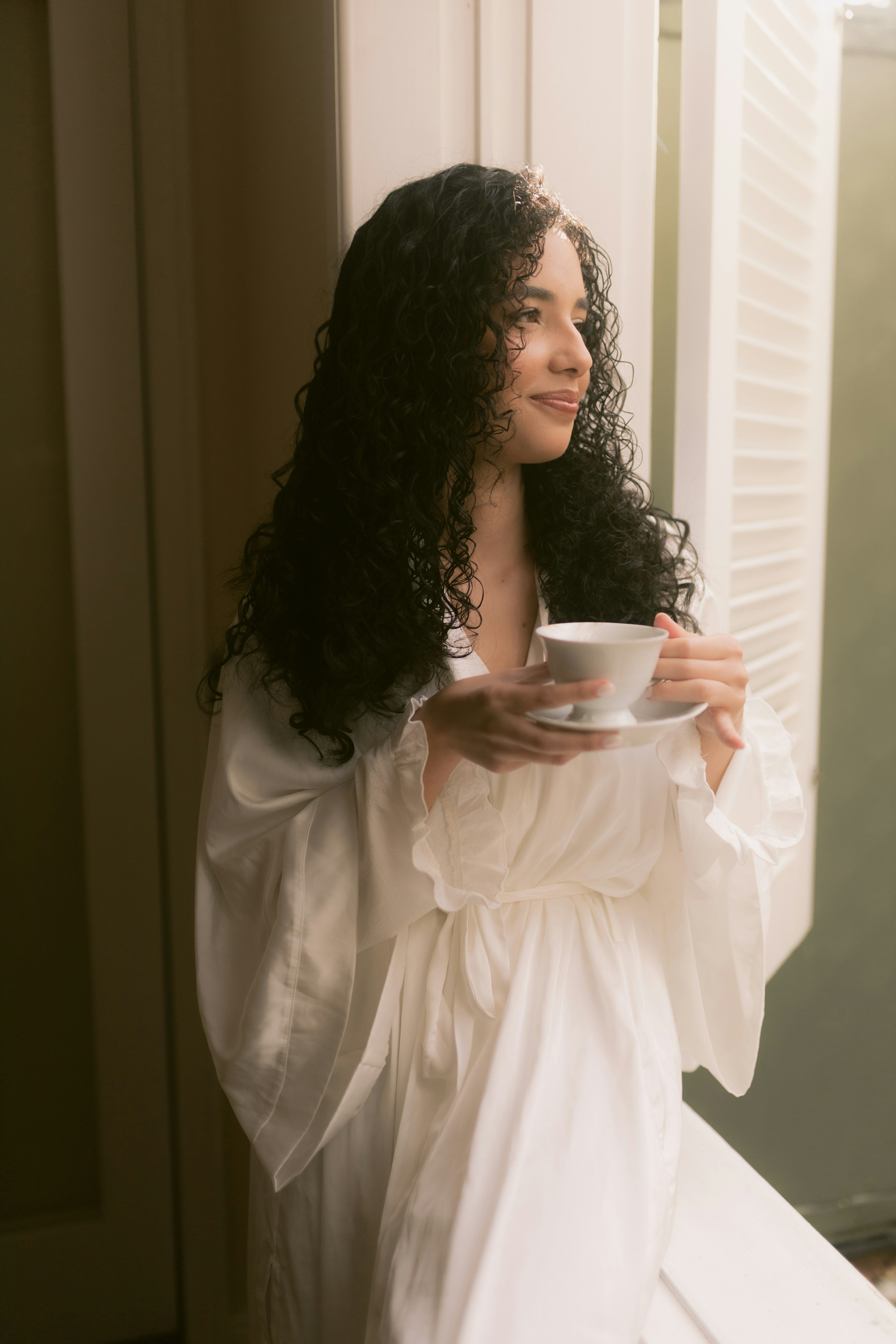 Morning Tea by the Window: A Quiet Portrait in Soft Light
