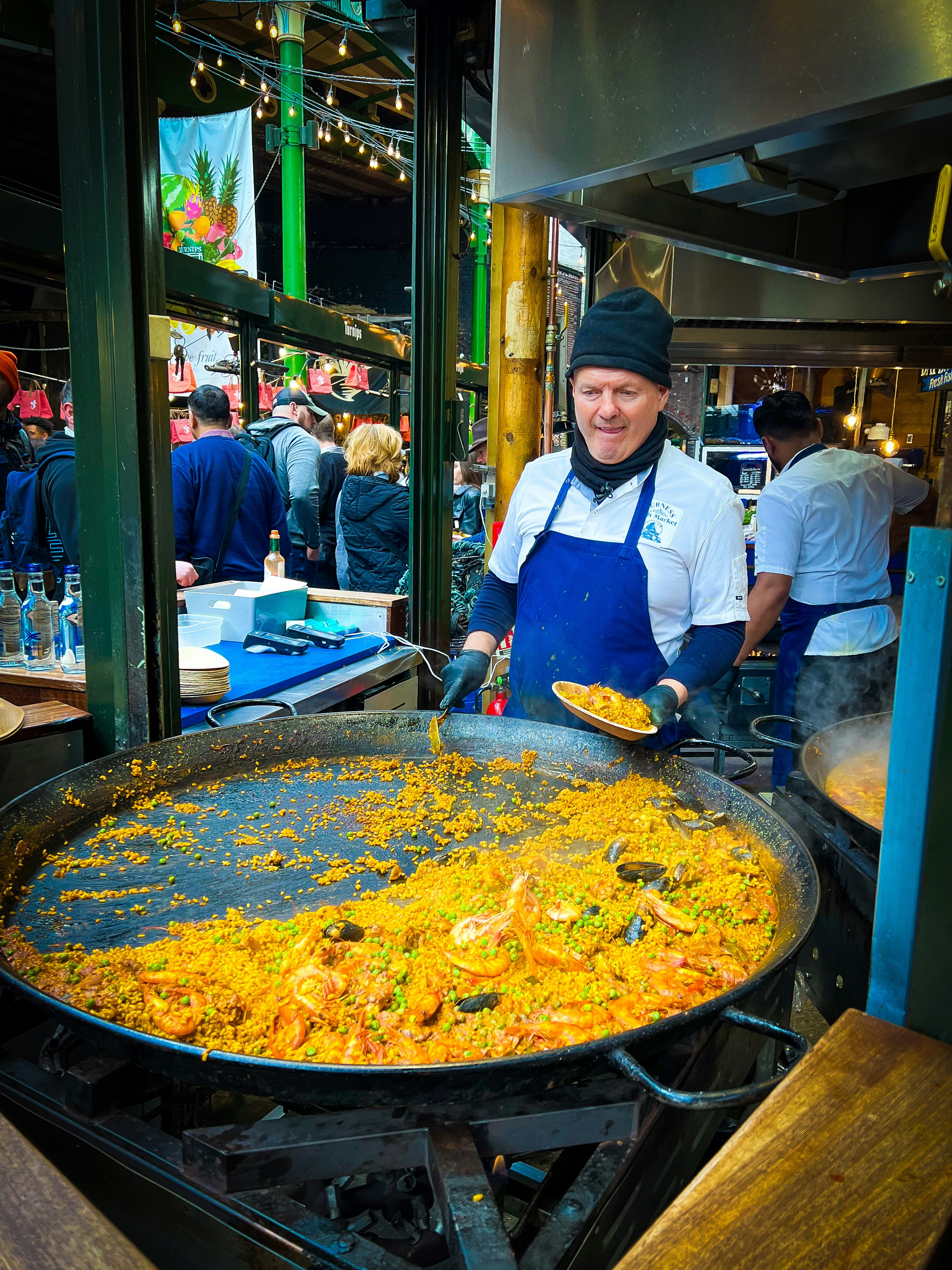 Paella at Borough Market | Chef serves up a delicious pan of paella.