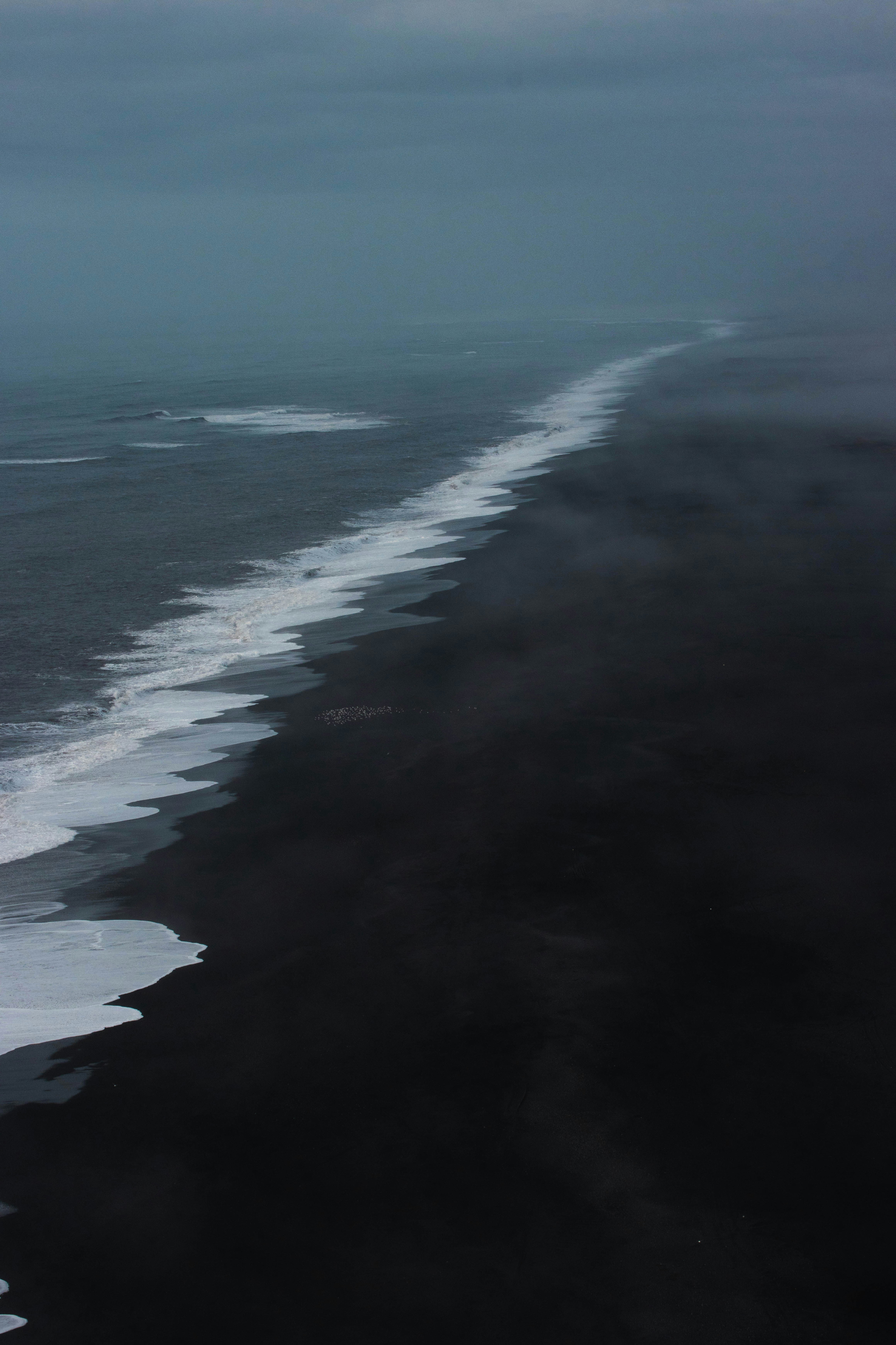 Ebbing Tides: A Monochrome Dance of Land and Sea