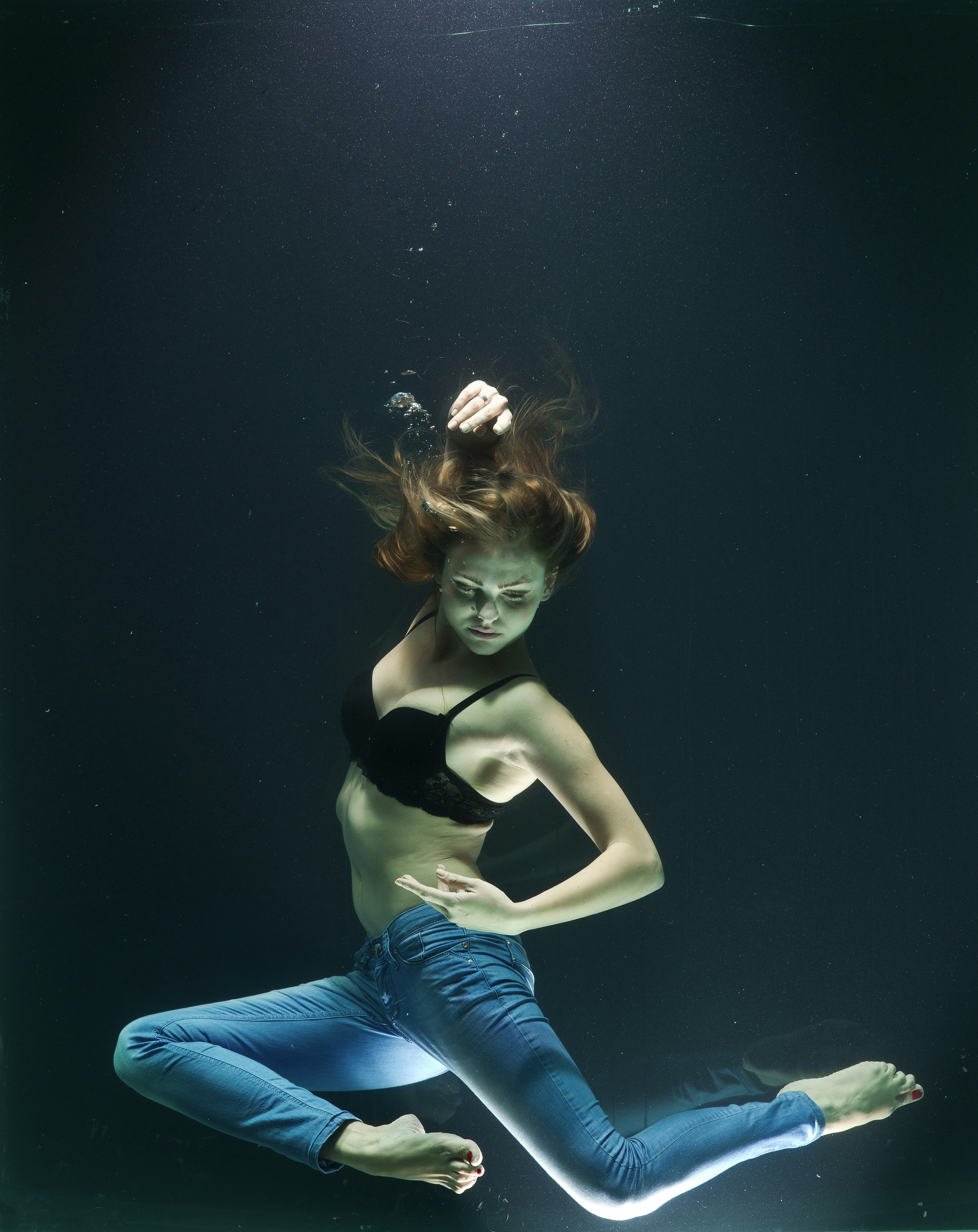 Liquid Grace: A Dancer Suspended in Deep Blue
