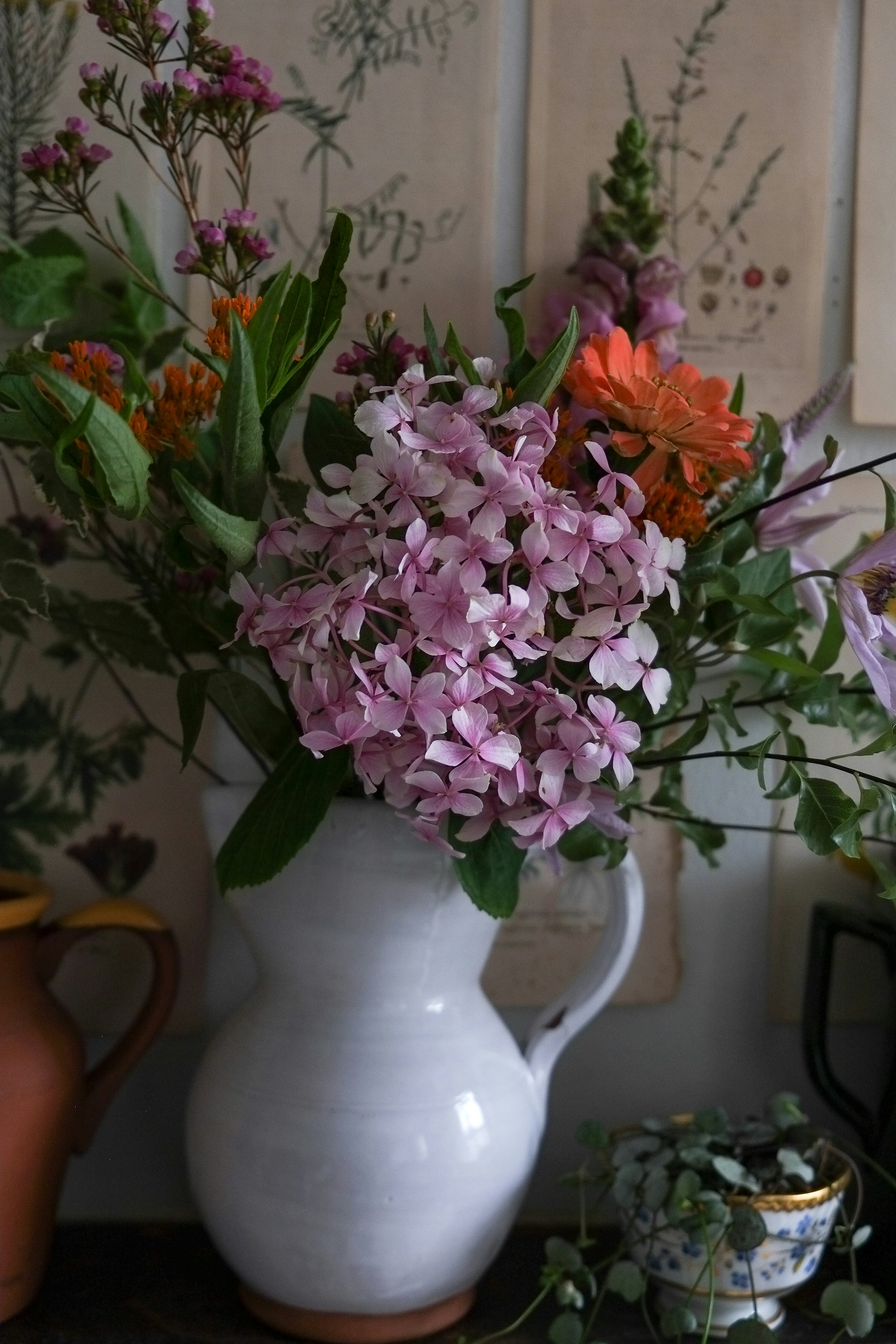 Pastel Hydrangea Chaos in a White Pitcher