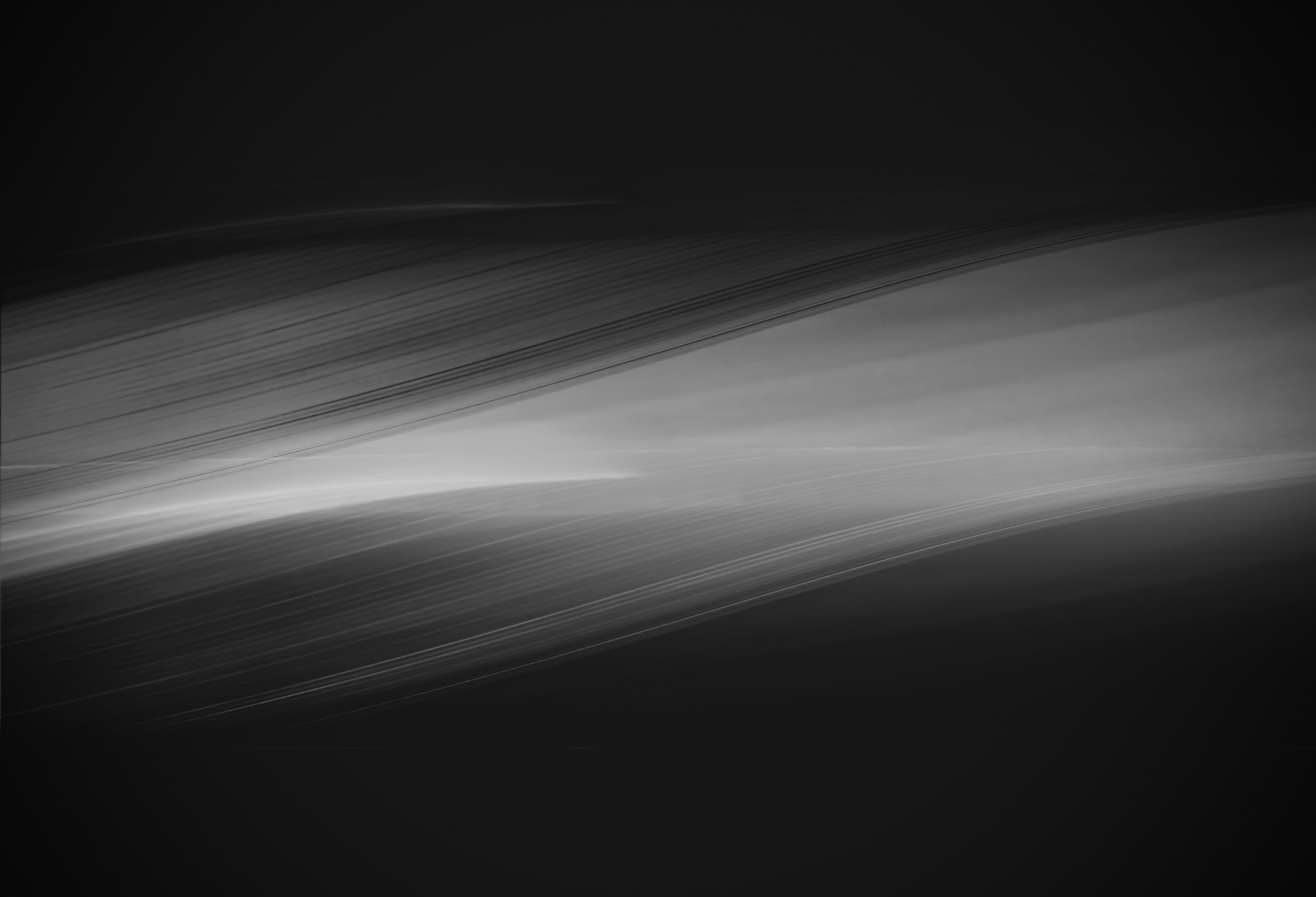 Abstract grayscale image with blurred light and dark.