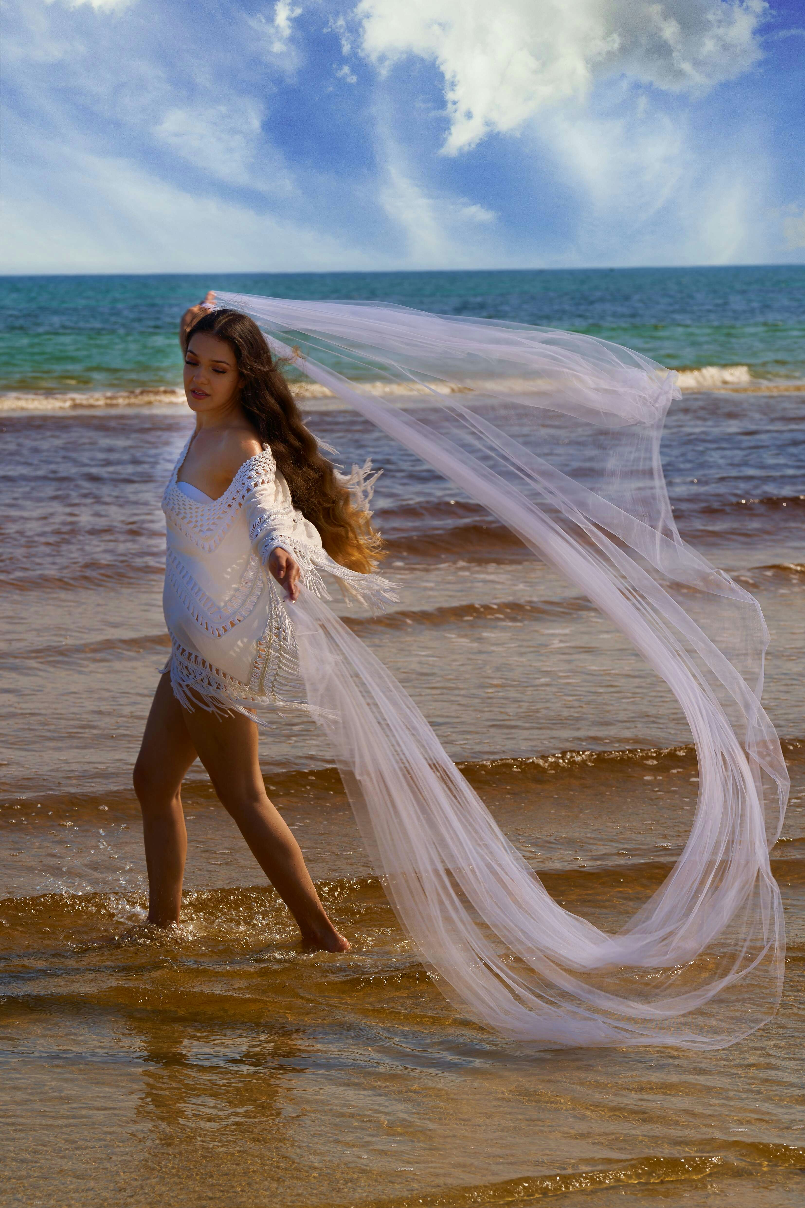 Sea-Born Veil: A Bride Walks the Tide-Washed Shore