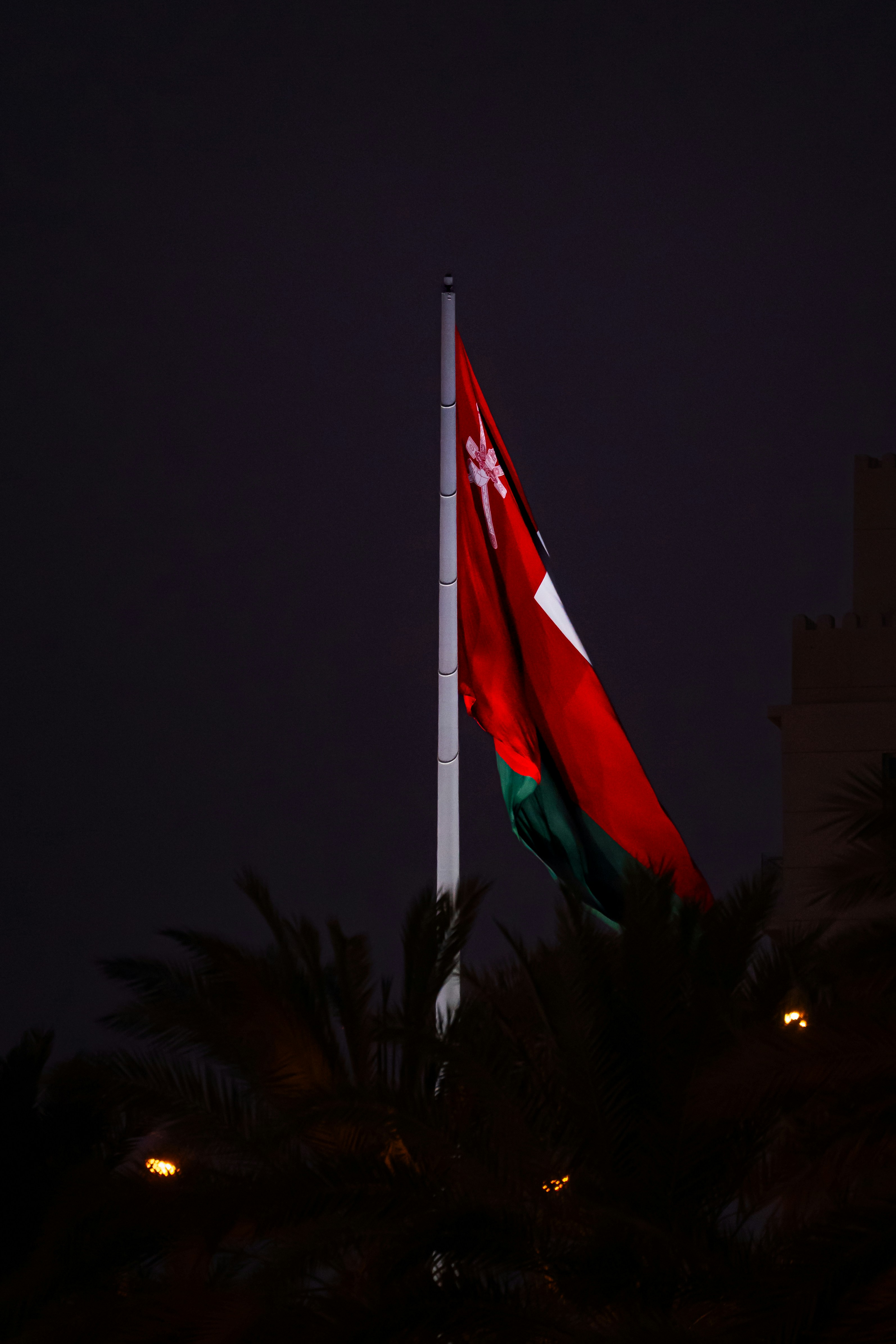 Whispers of Heritage: The Omani Flag in Twilight