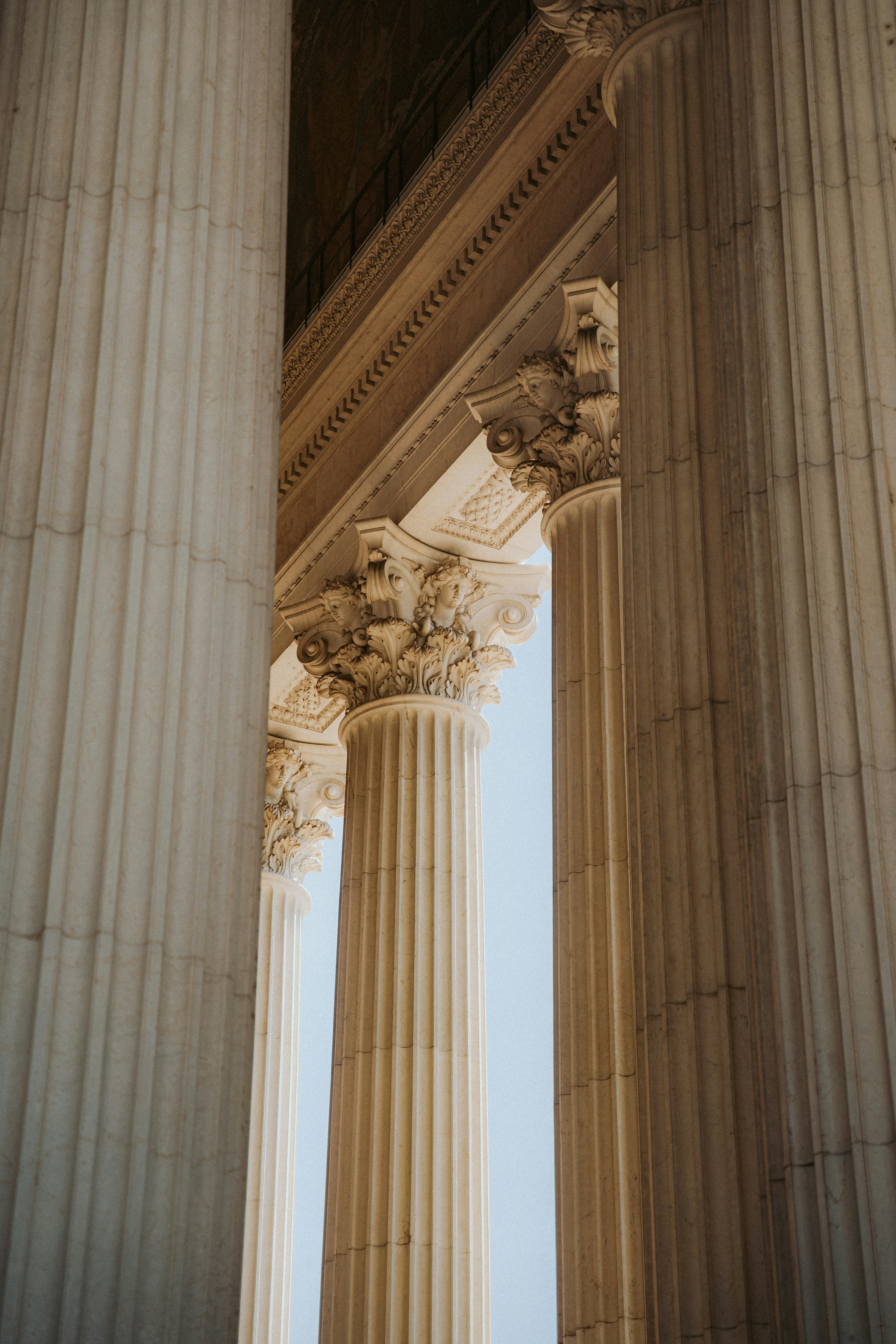 Columns of a building stand tall and majestic. photo – Free Building ...