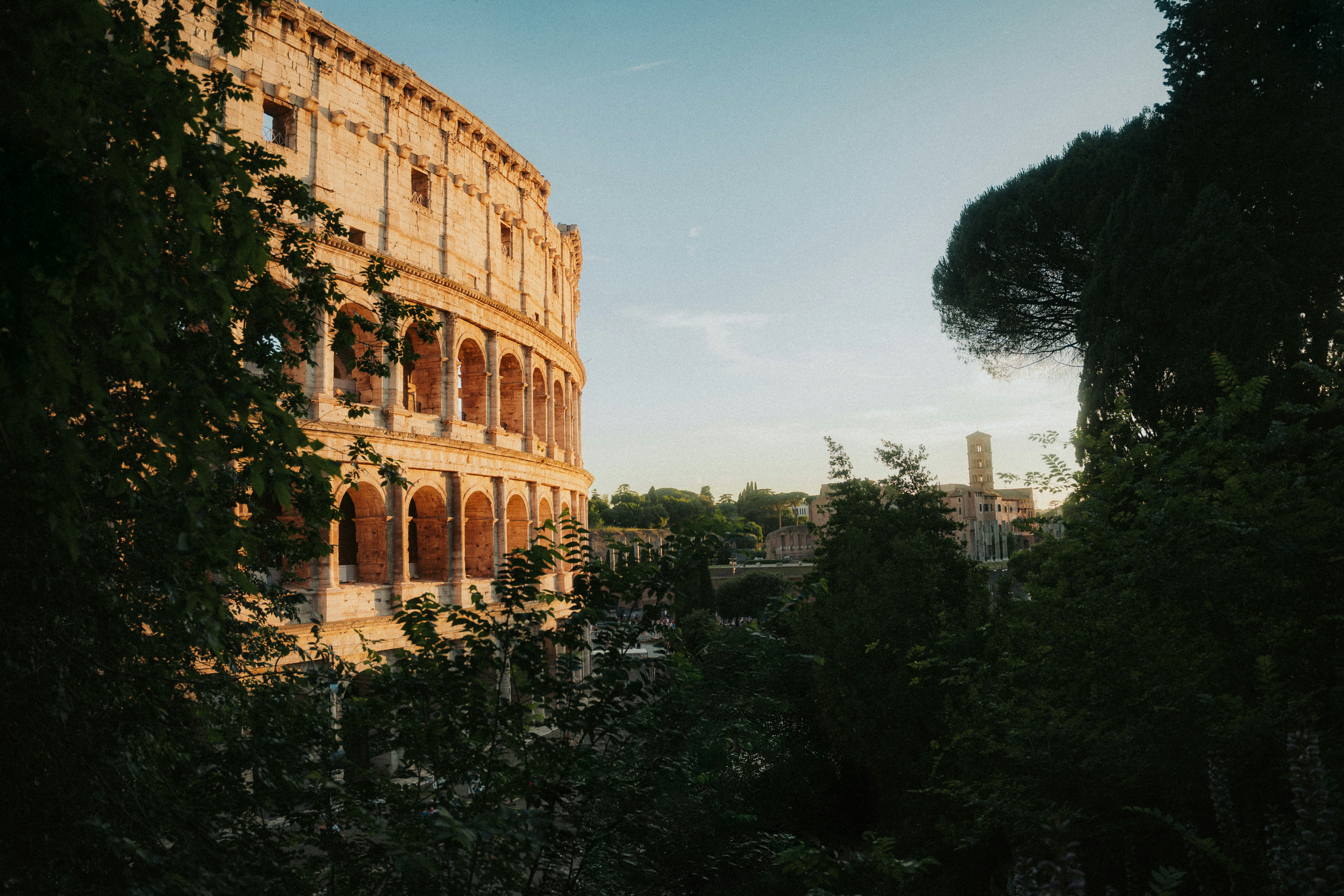 The colosseum stands tall in the roman landscape. photo – Free Building ...