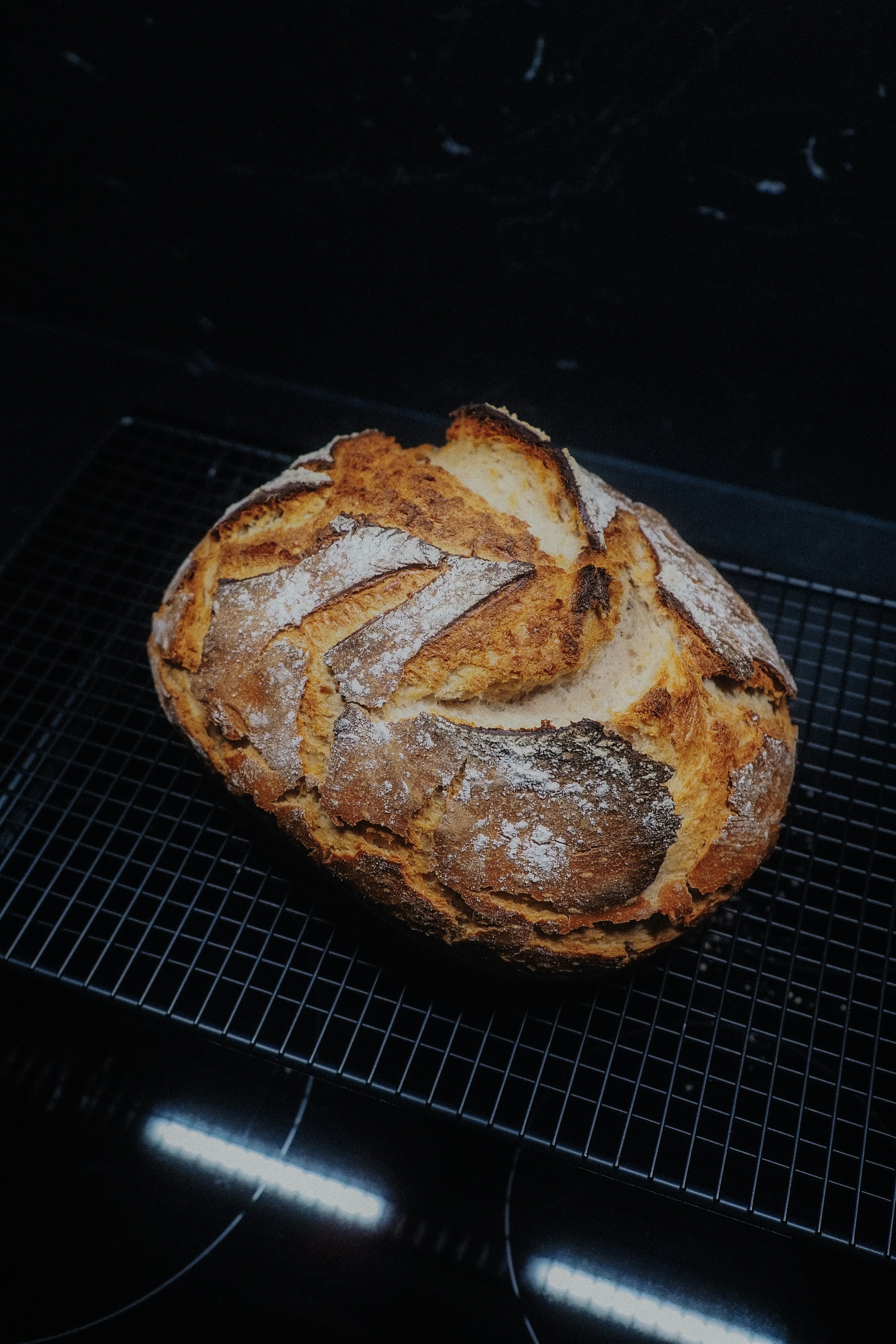 Freshly baked bread rests on a cooling rack.