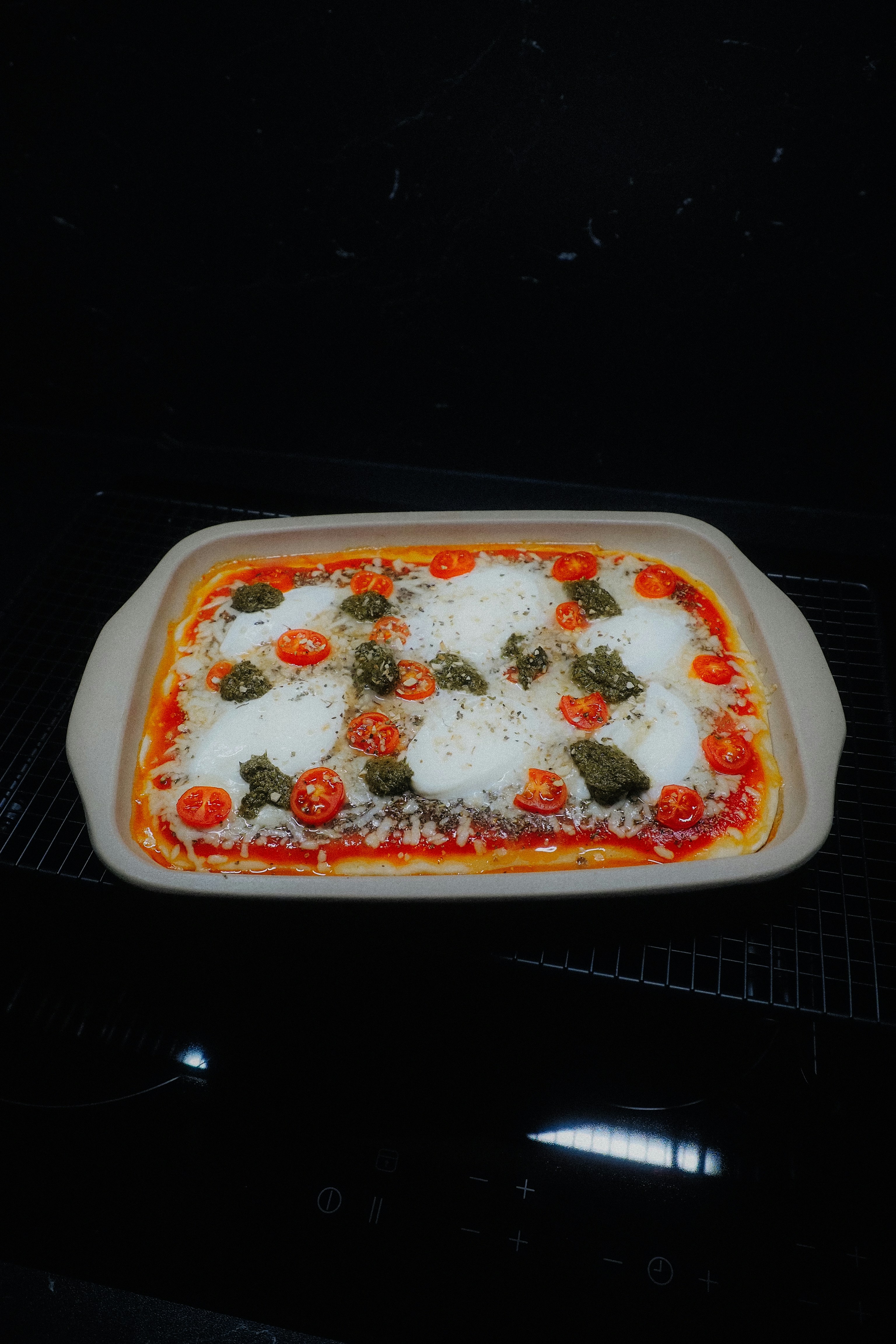 A delicious pizza is baking in the oven.