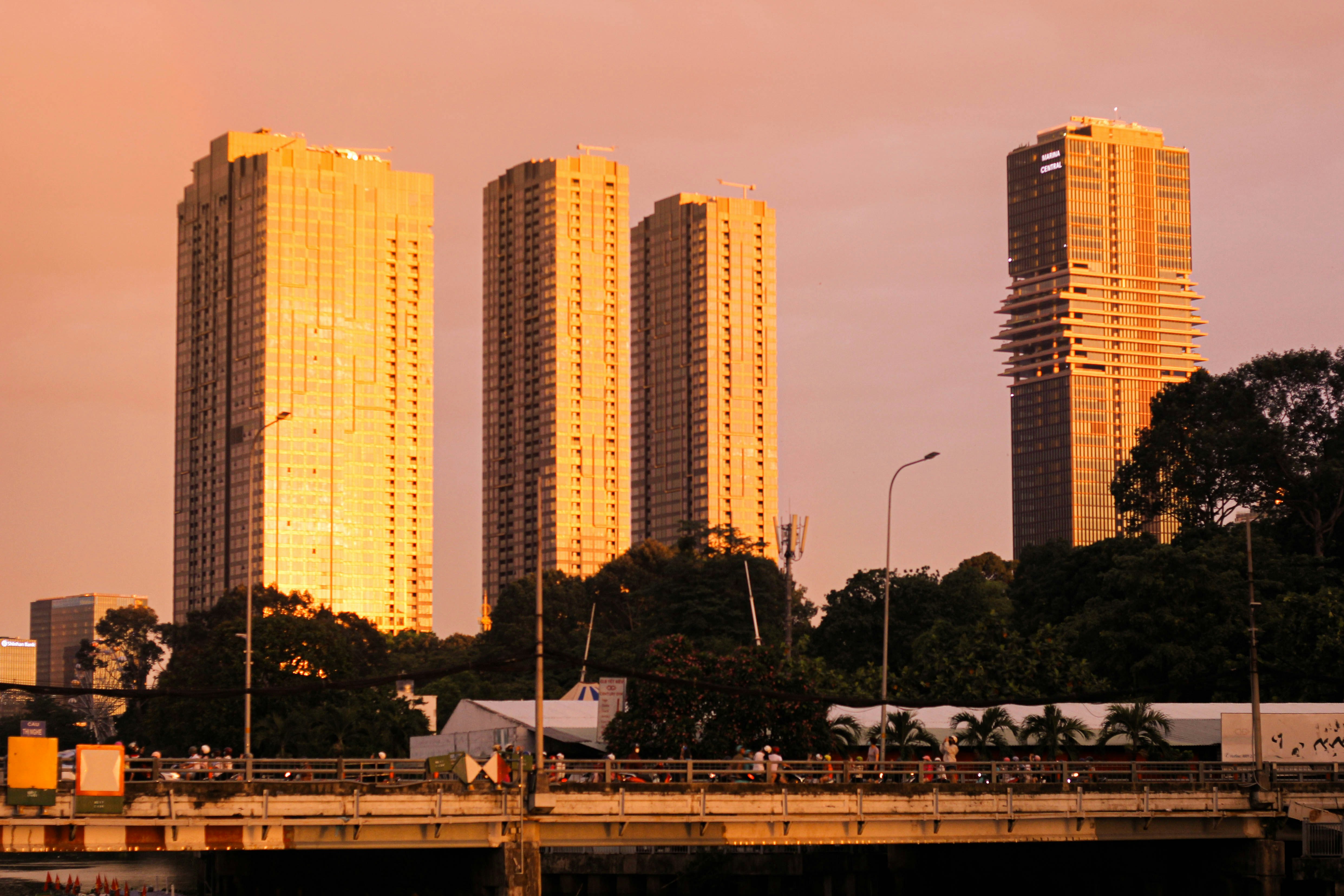 Sunset Veil over the Riverside Skyline: Amber Towers Framing the Waterfront