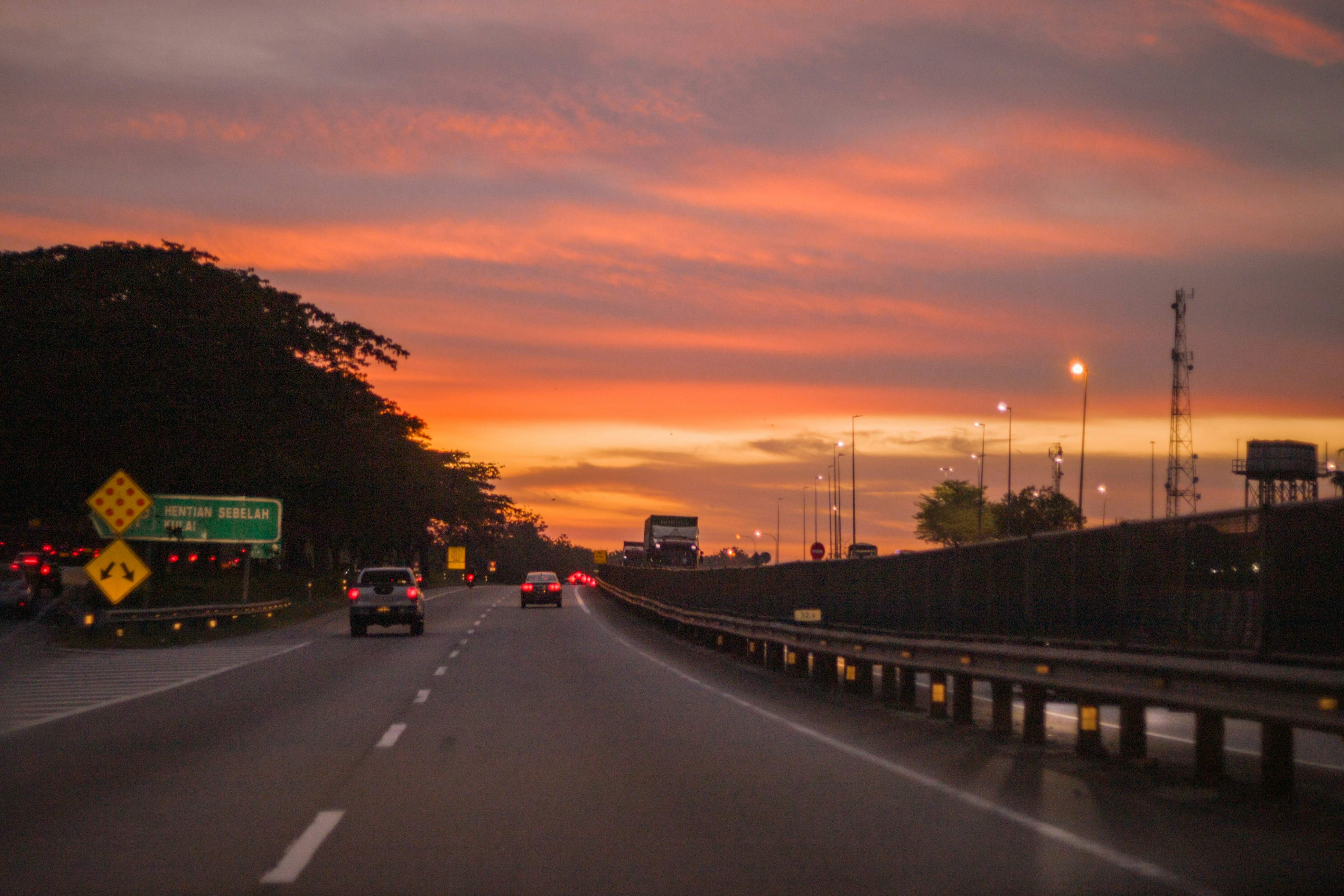 A highway scene bathed in beautiful sunset colors. photo – Free Travel ...