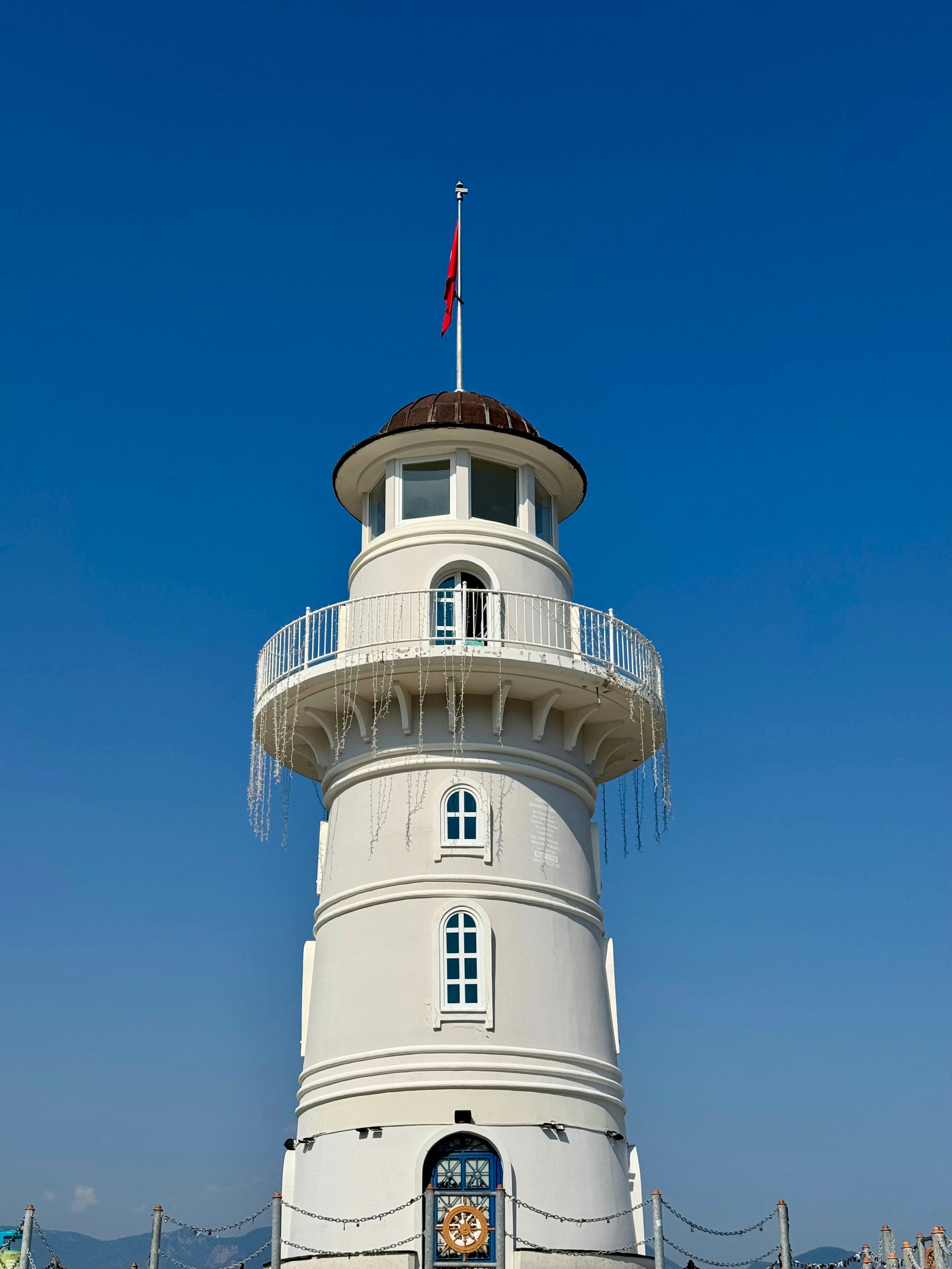 Ivory Lighthouse Crowned by a Pristine Blue Sky