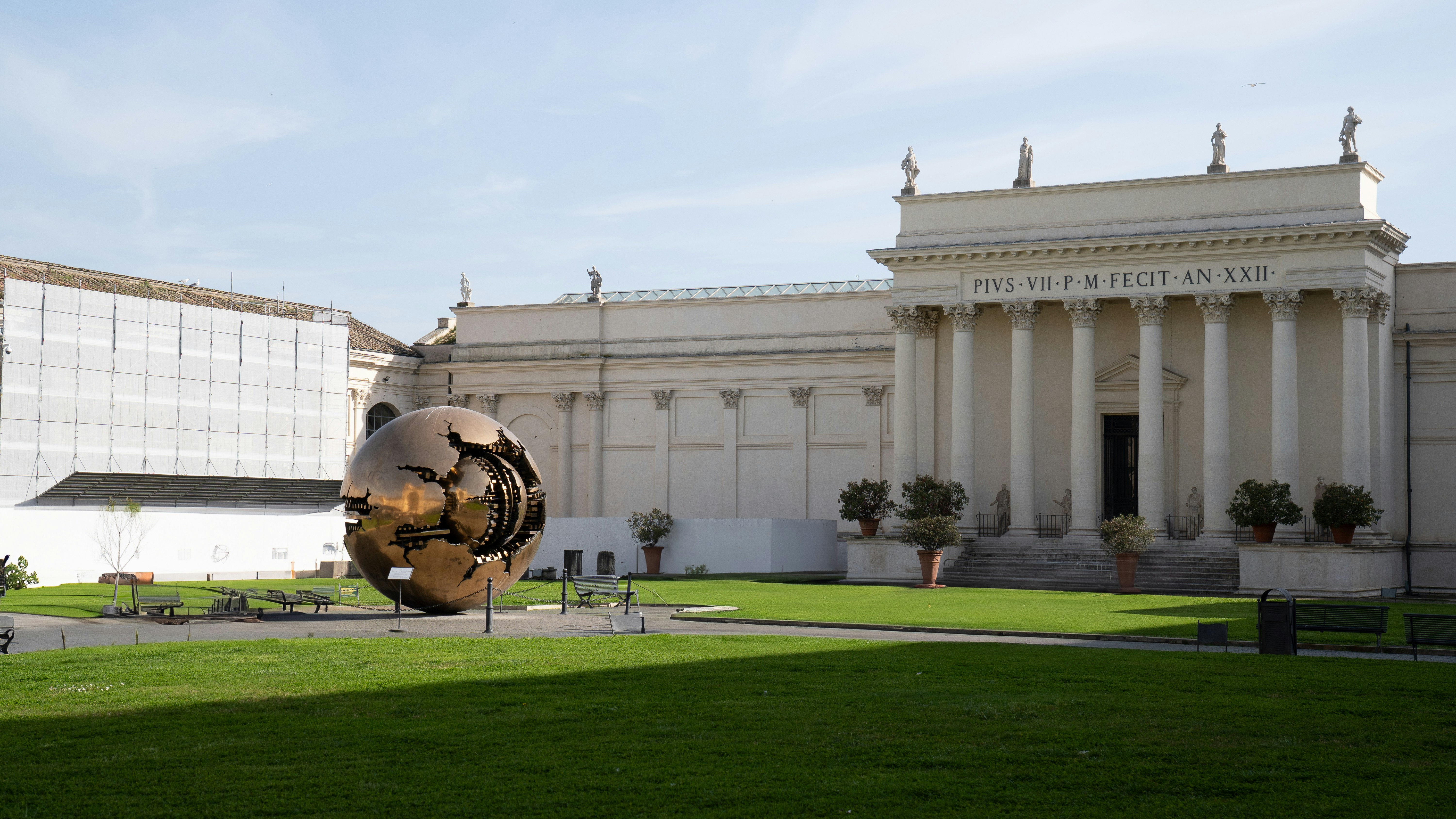 Sculpted Globe and Classical Facade: Quiet Museum Grounds