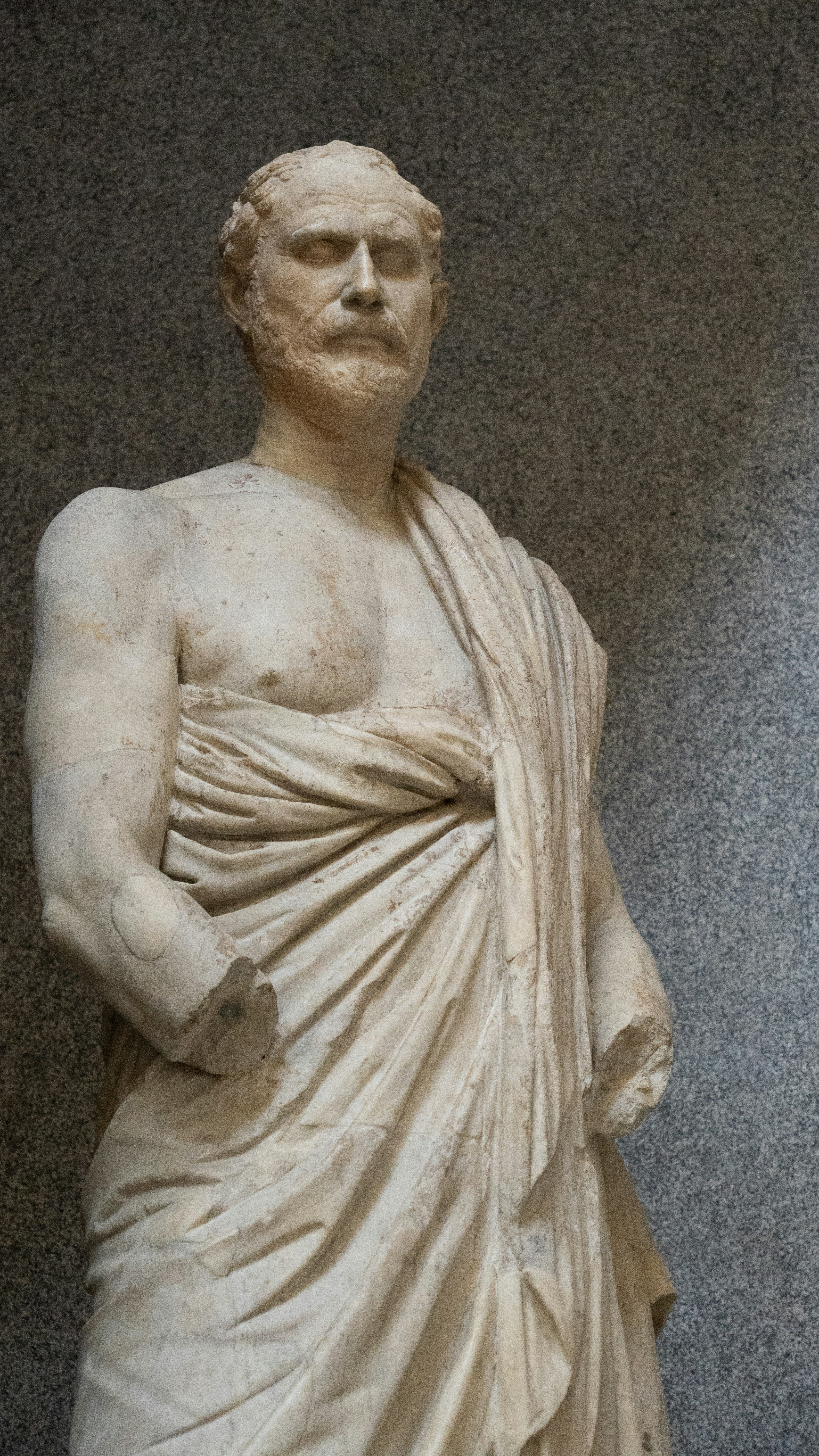A marble statue of an ancient man.