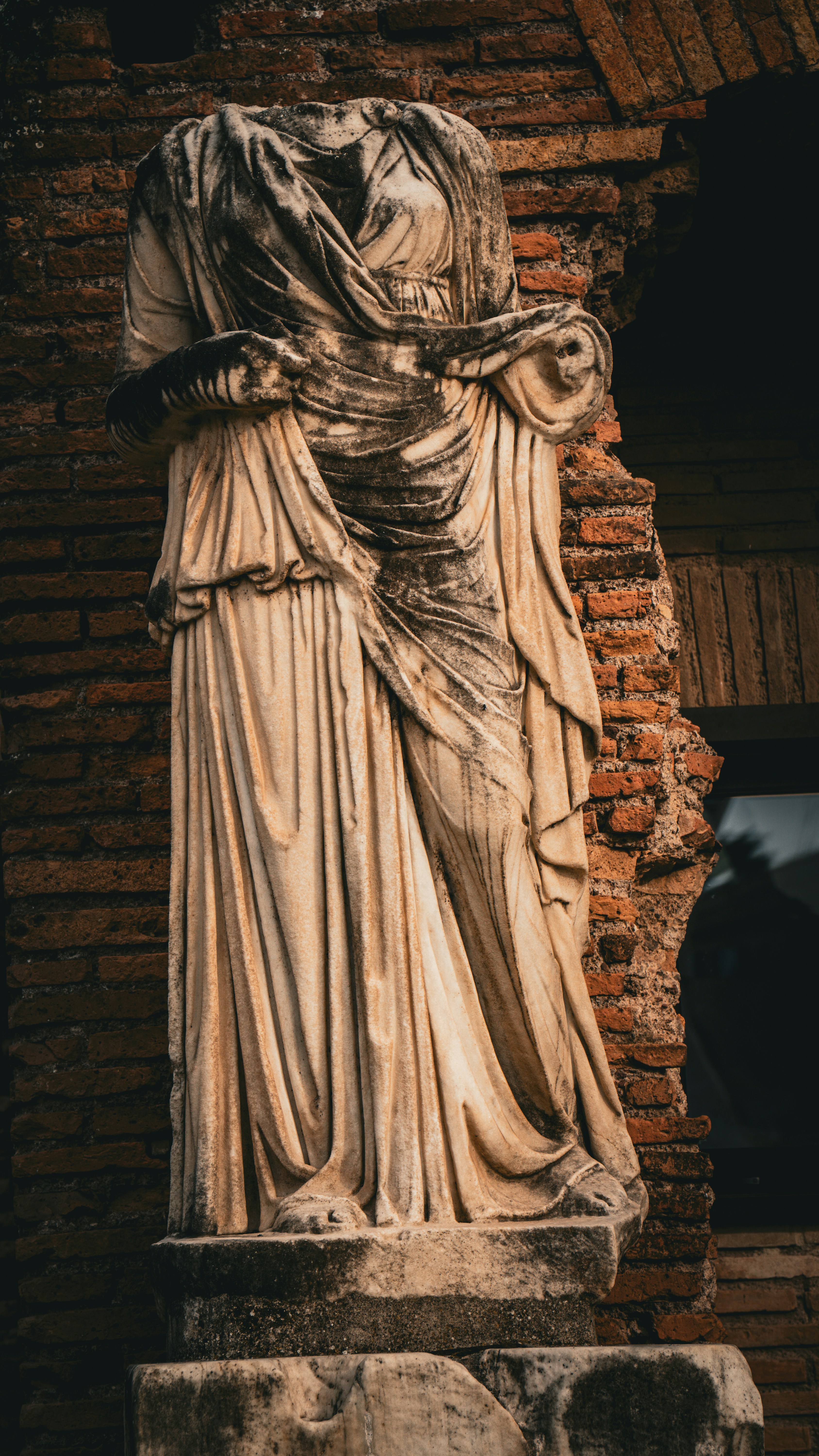 Whispers of Time: The Silent Elegance of a Headless Statue