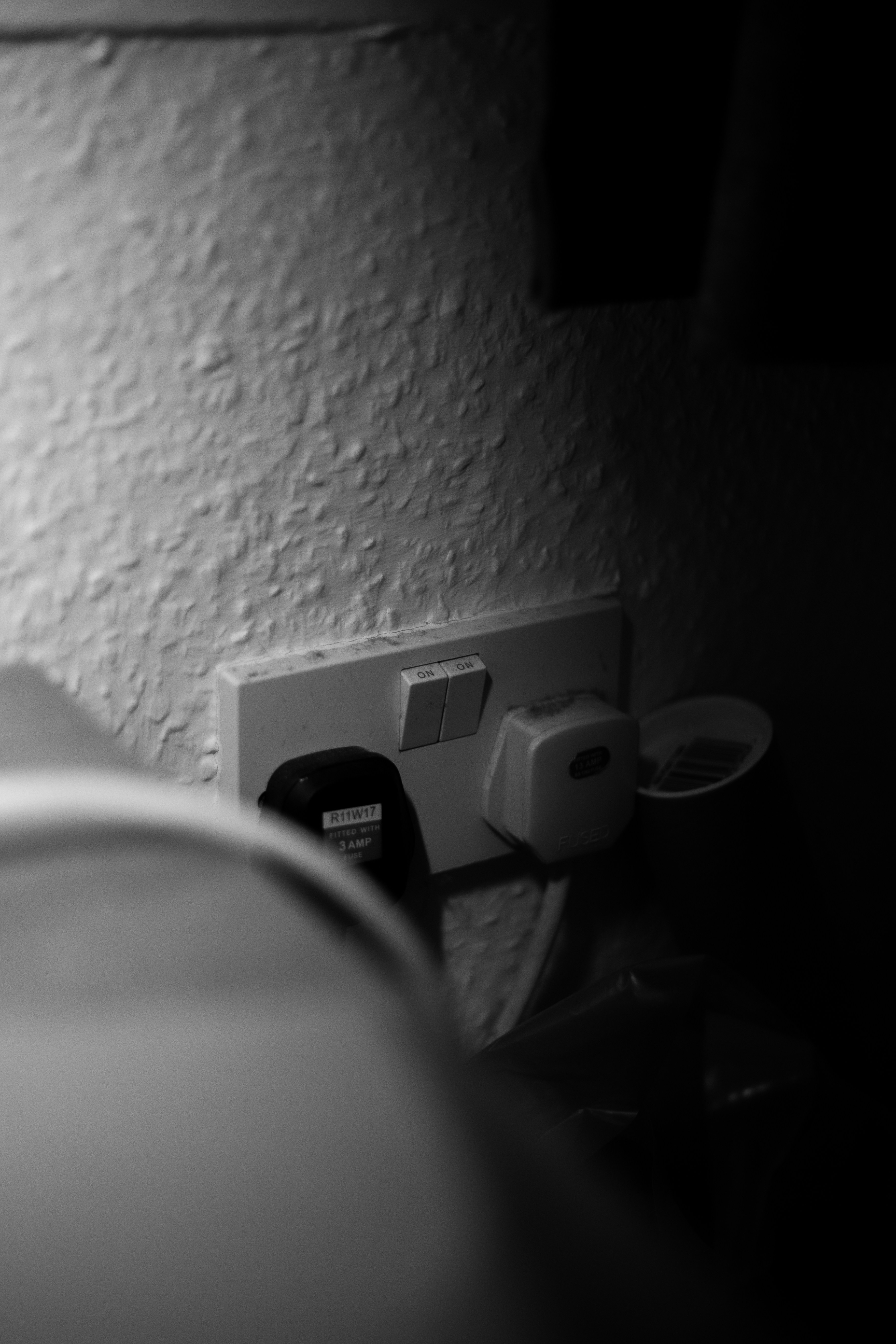 Electrical outlet in black and white photography.