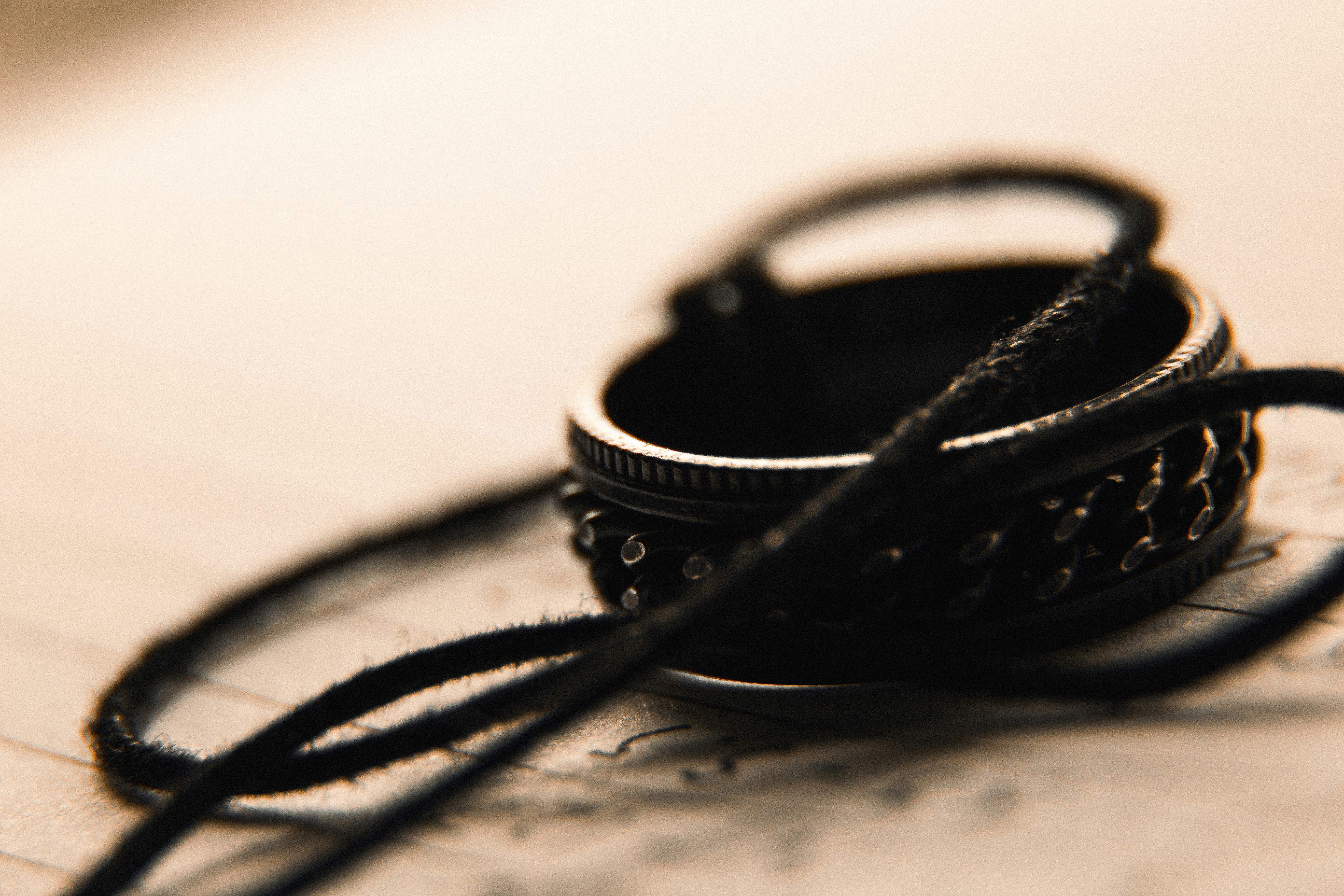 Rings and Cord: Quiet Minimalism on a Wooden Surface