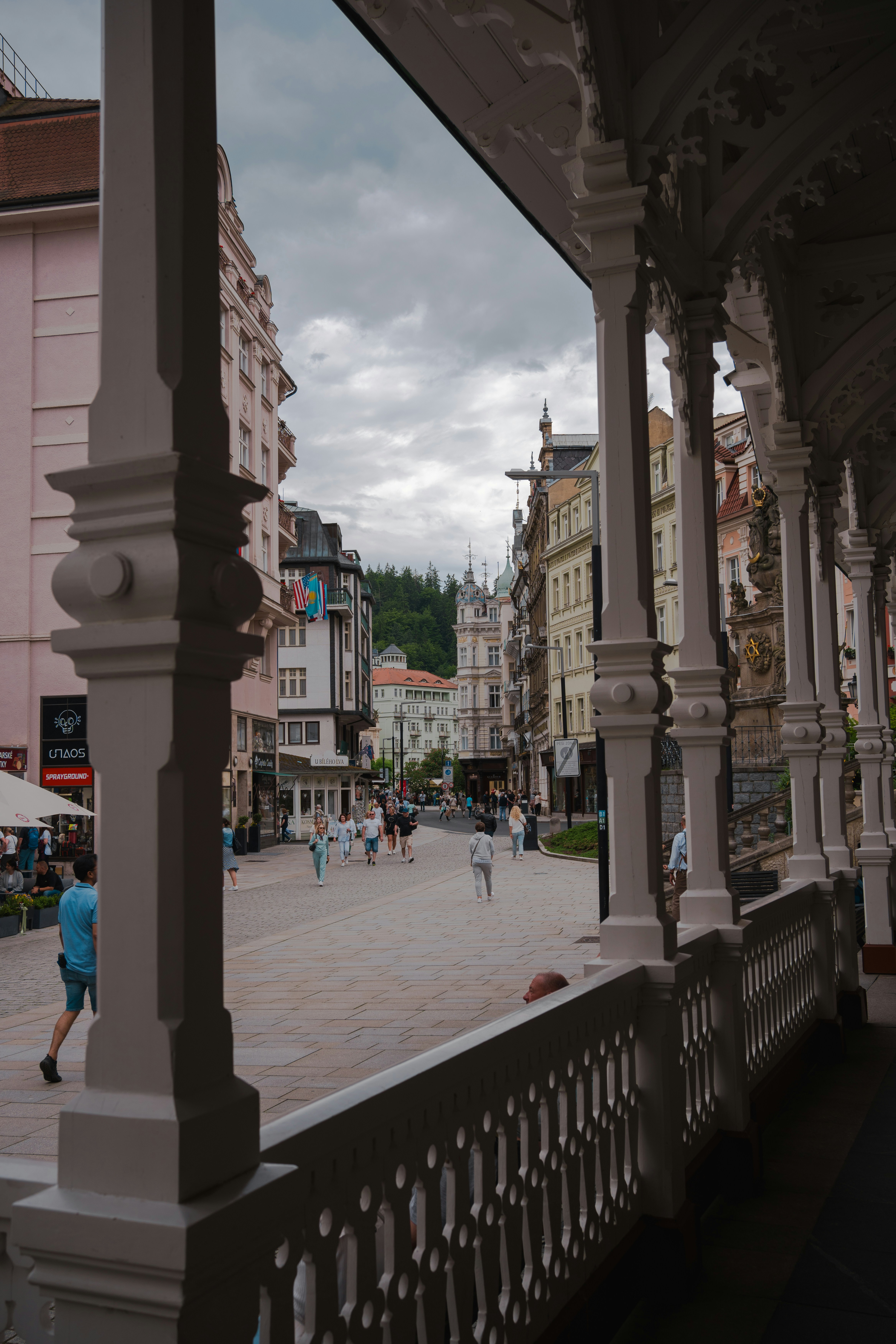 View of a european street from a decorative structure.