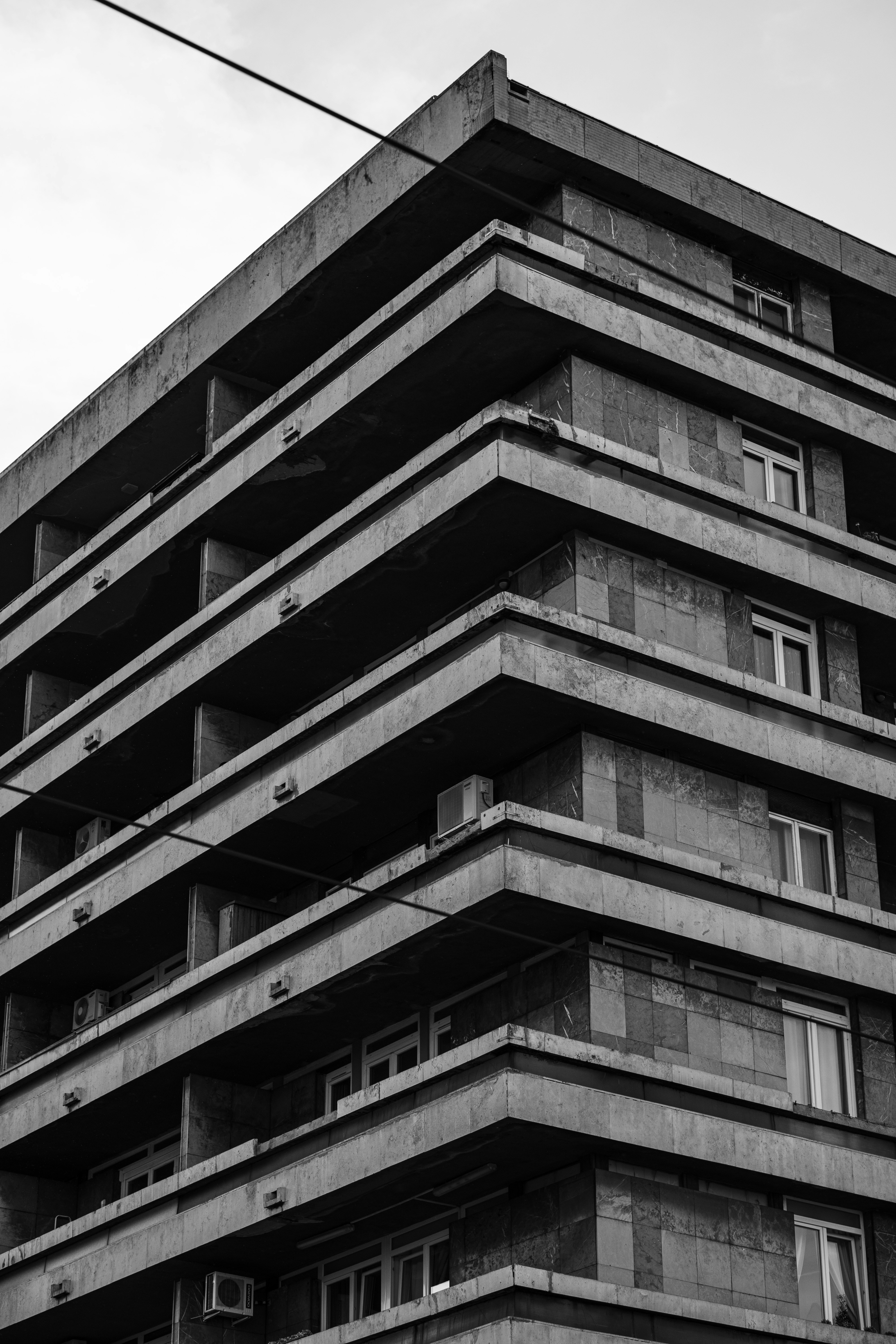 An angular concrete building stands tall. photo – Free Building Image ...