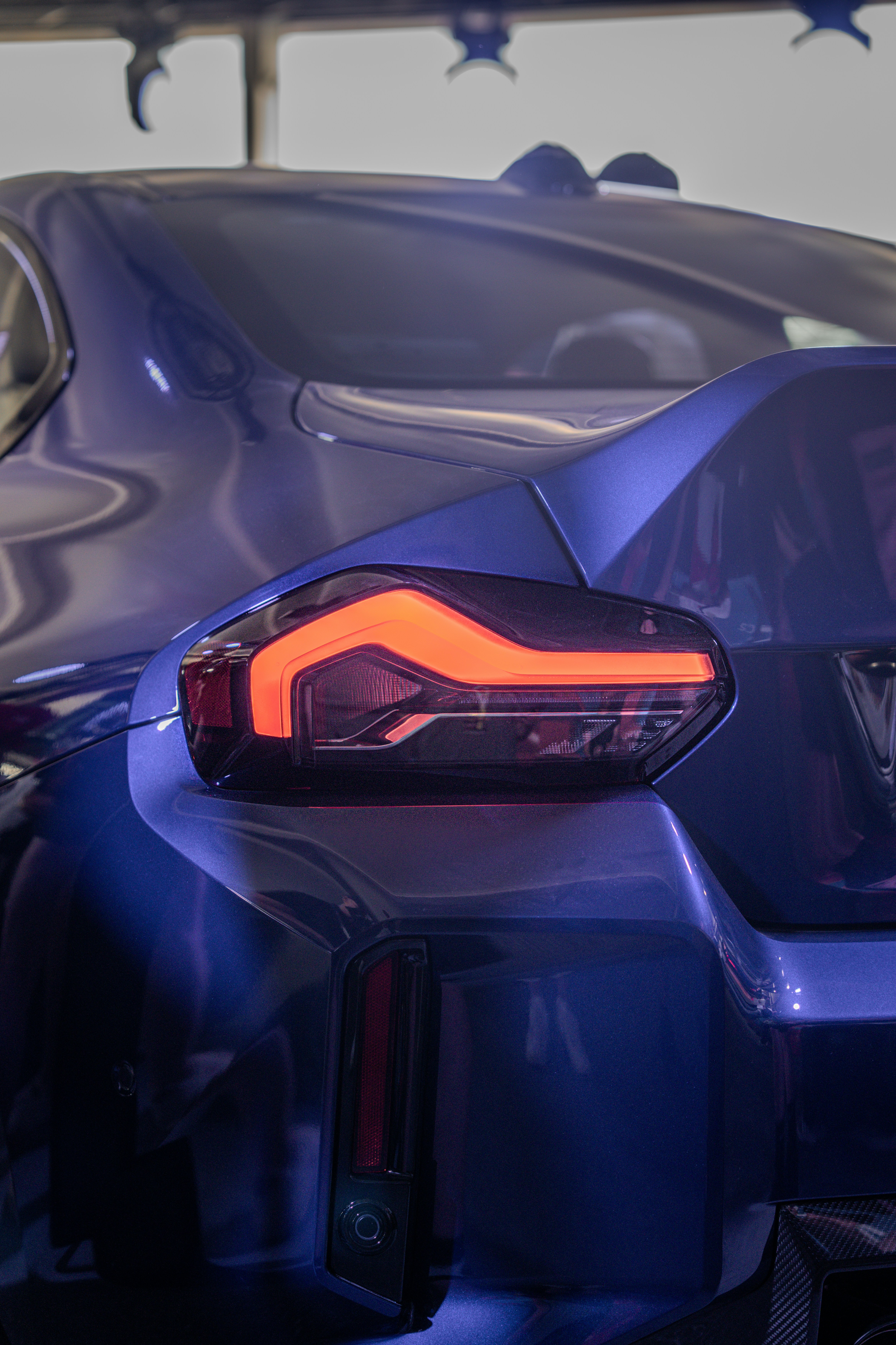 Cobalt Contours: Neon Tail Light of a Modern Coupe