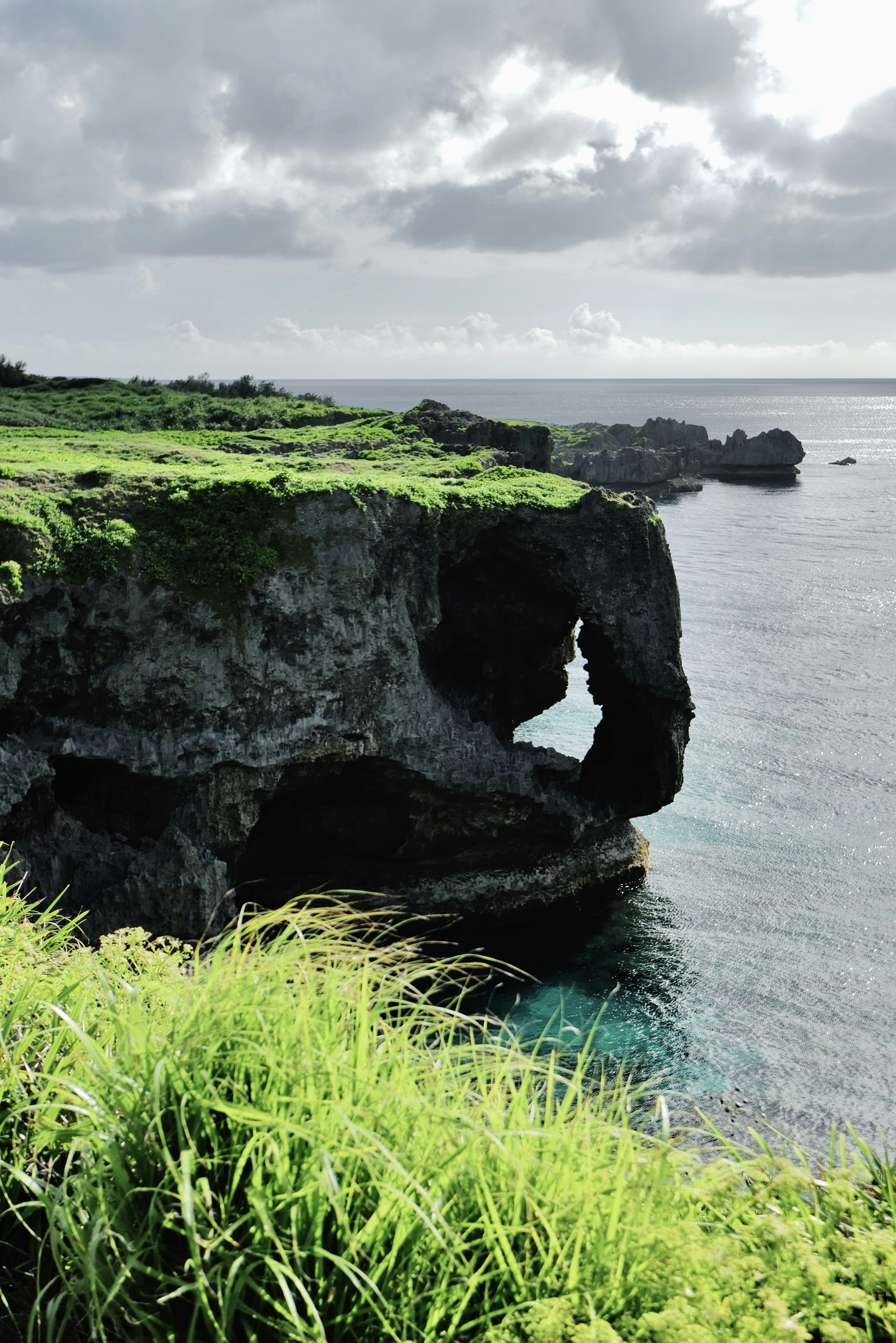 Dramatic coastal cliffs with an archway carved by the sea. photo – Free ...