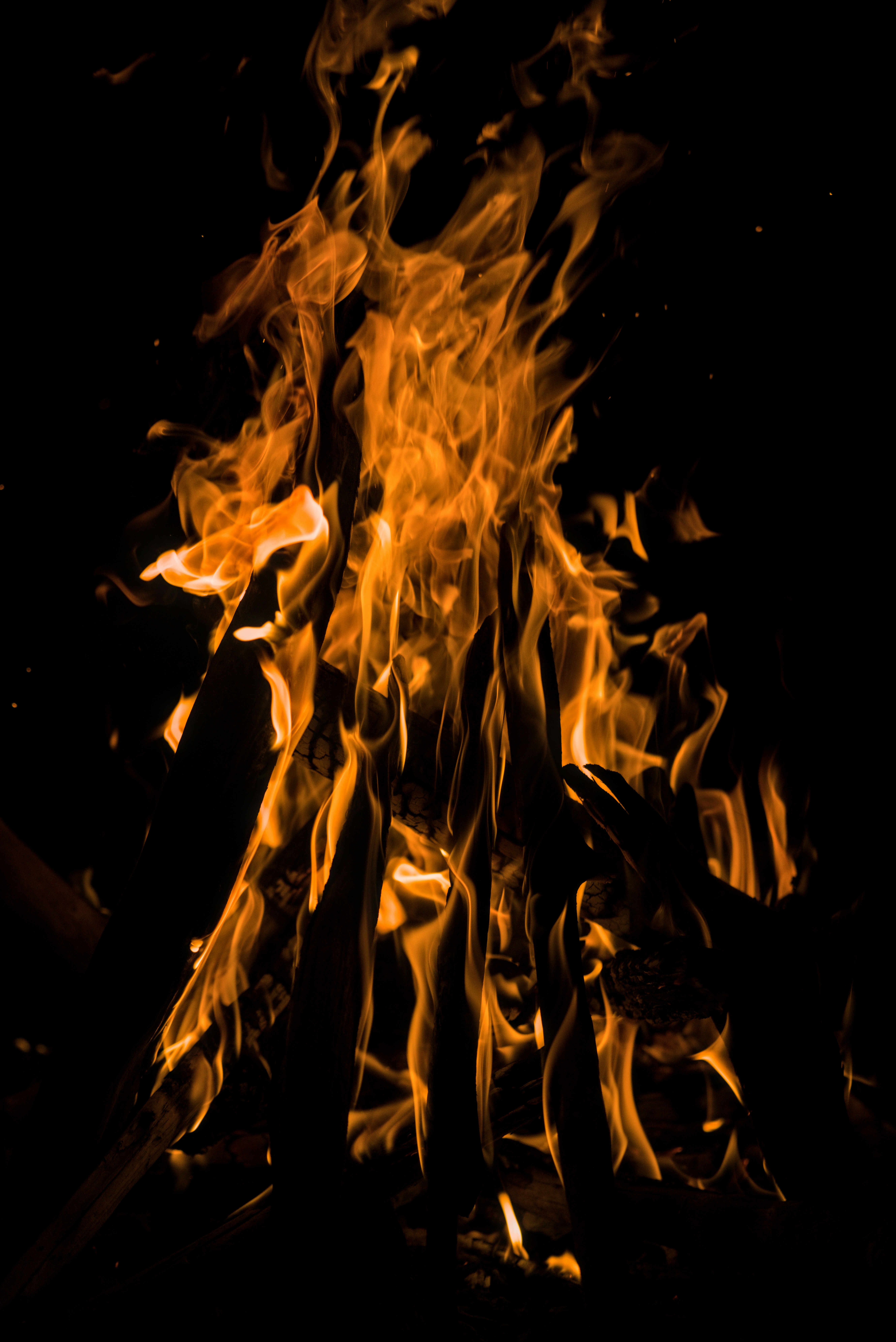 Flames rise high against a dark background. photo – Free Wallpaper for ...