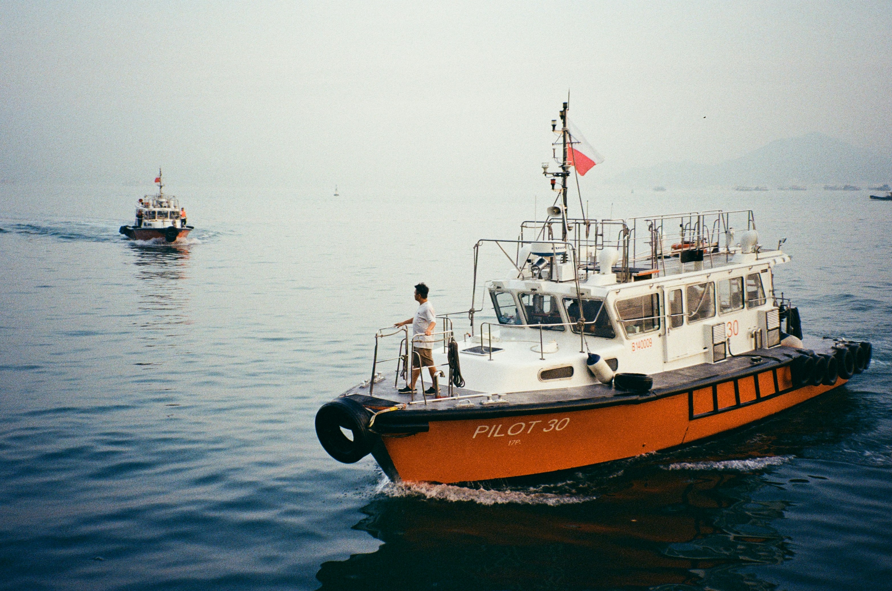 Two pilot boats are sailing on the water. photo – Free Sea Image on ...