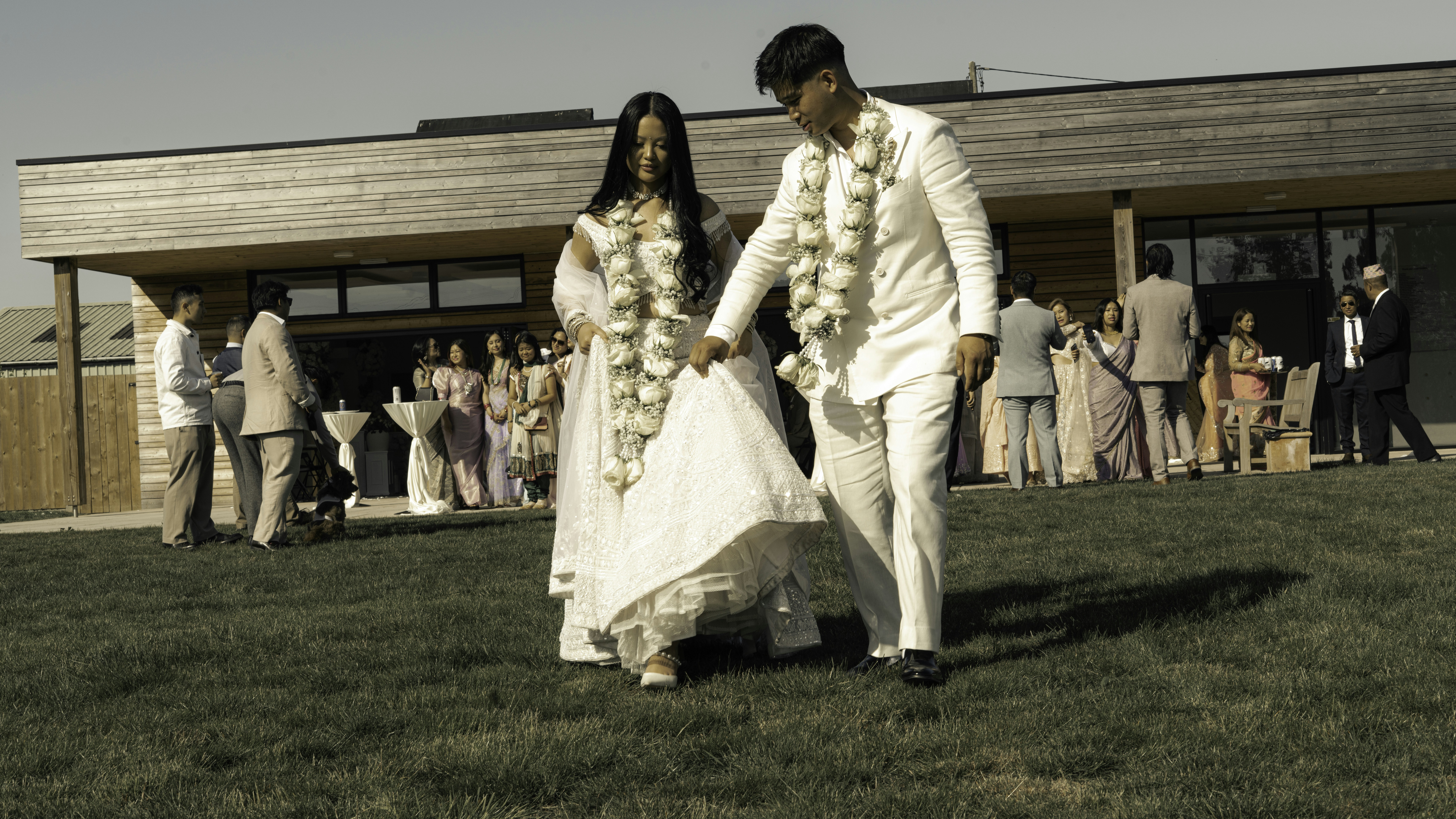 Bride and Groom Walk Beyond the Floral Gate