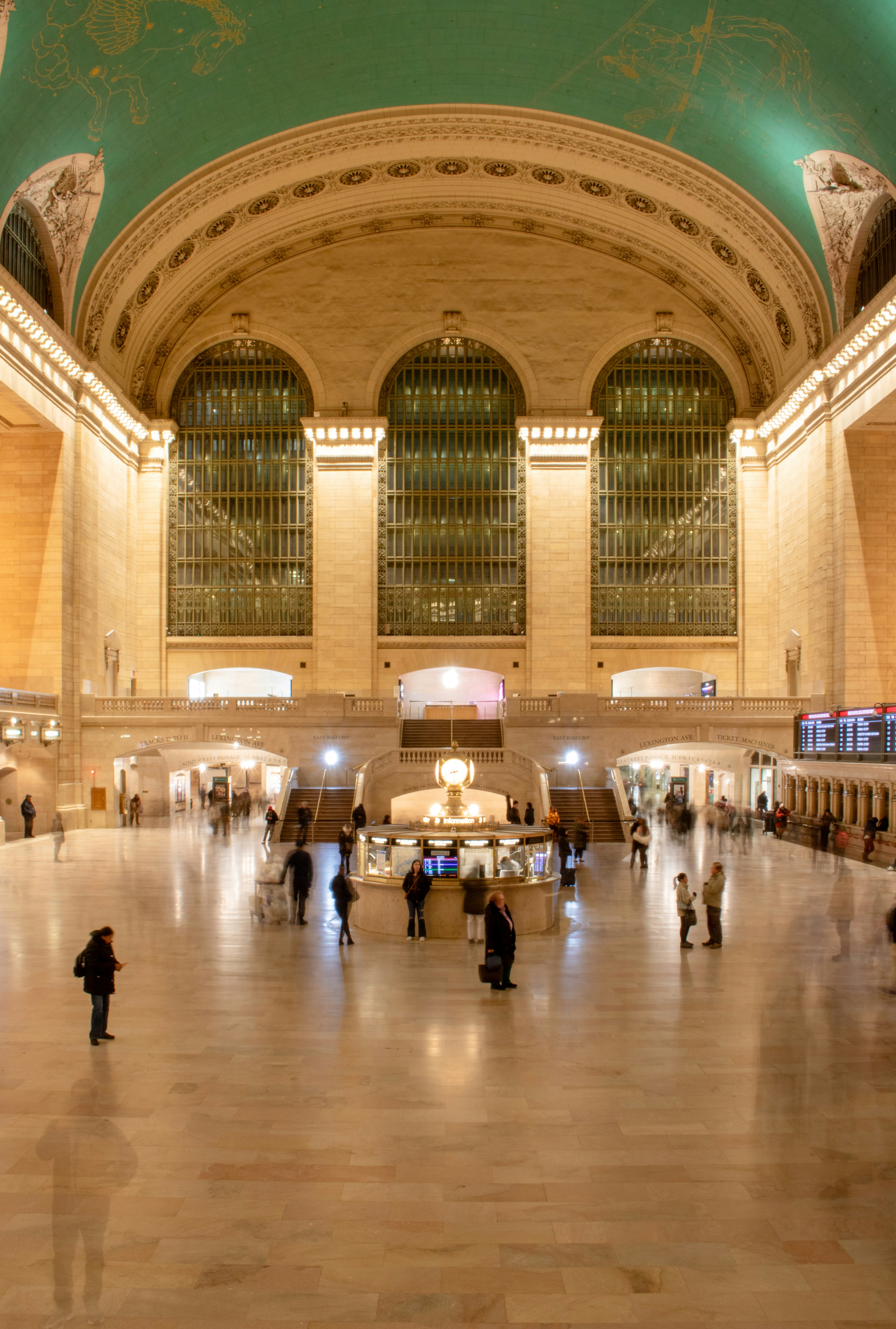 Grand Central Terminal, often called Grand Central Station, is a historic commuter rail terminal in Midtown Manhattan, New York City. It's a transportation hub, architectural marvel, and a symbol of the city's resilience. It's known for its Beaux-Arts design, including the celestial ceiling in the Main Concourse and the iconic four-faced clock. The terminal serves as the southern terminus for the Metro-North Railroad's Harlem, Hudson, and New Haven lines. | Grand central terminal's impressive main concourse.
