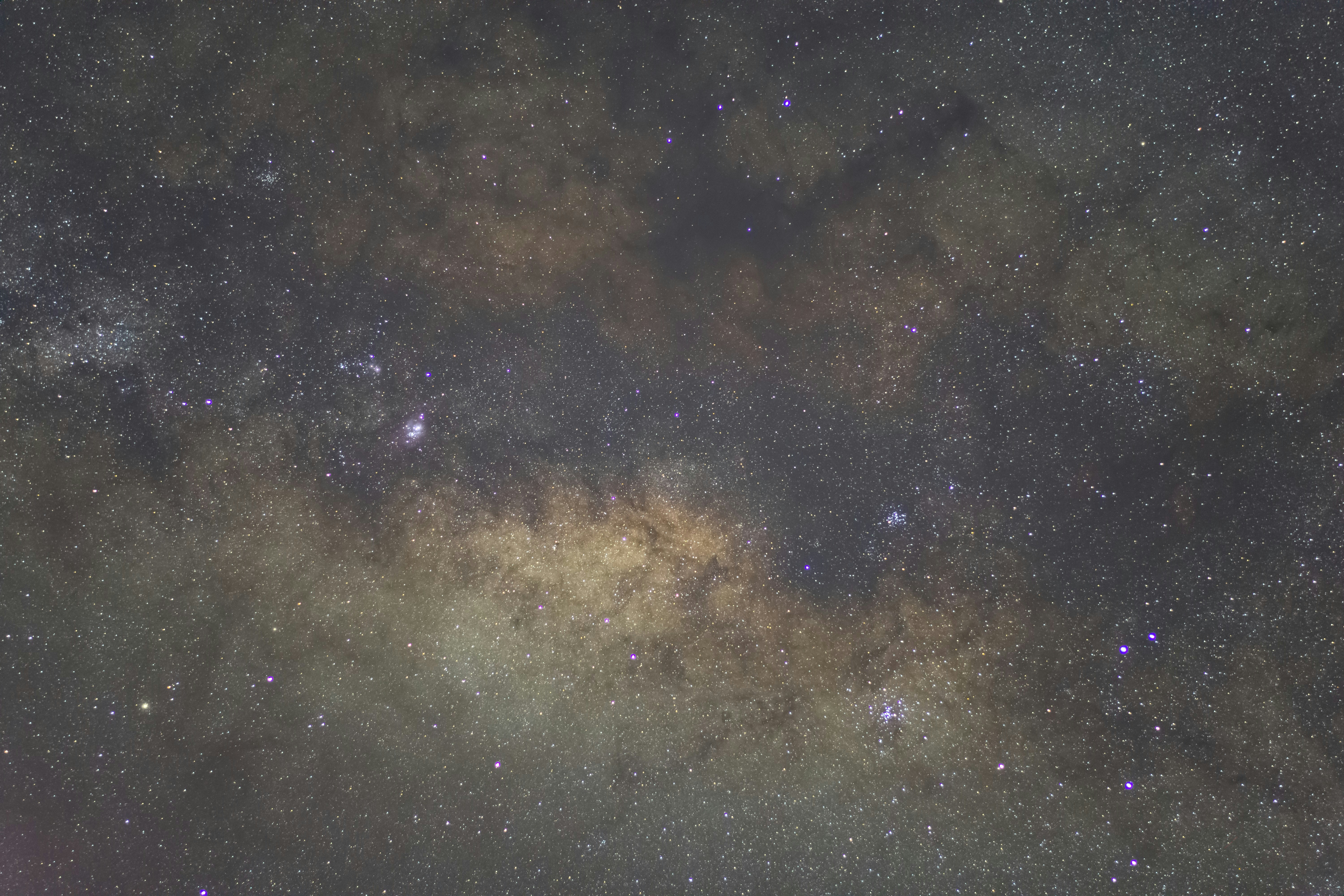 This picture was taken a while ago when I started to grasp methods to use for stacking images like this, and it turned out great. Though better lenses could help the 'purple stars'. | The milky way galaxy is visible in the image.