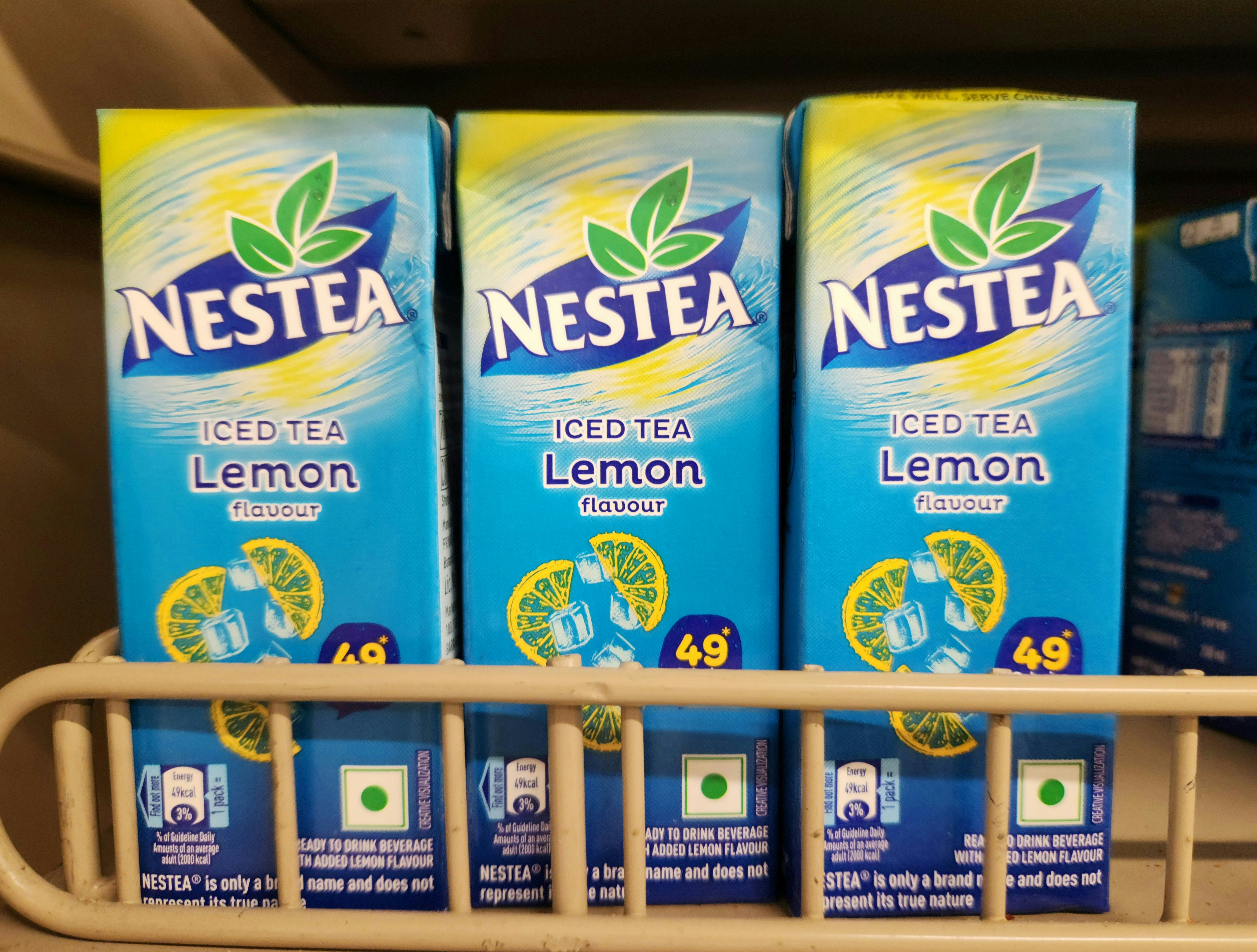 Three boxes of nestea lemon iced tea. photo – Free Blue Image on Unsplash