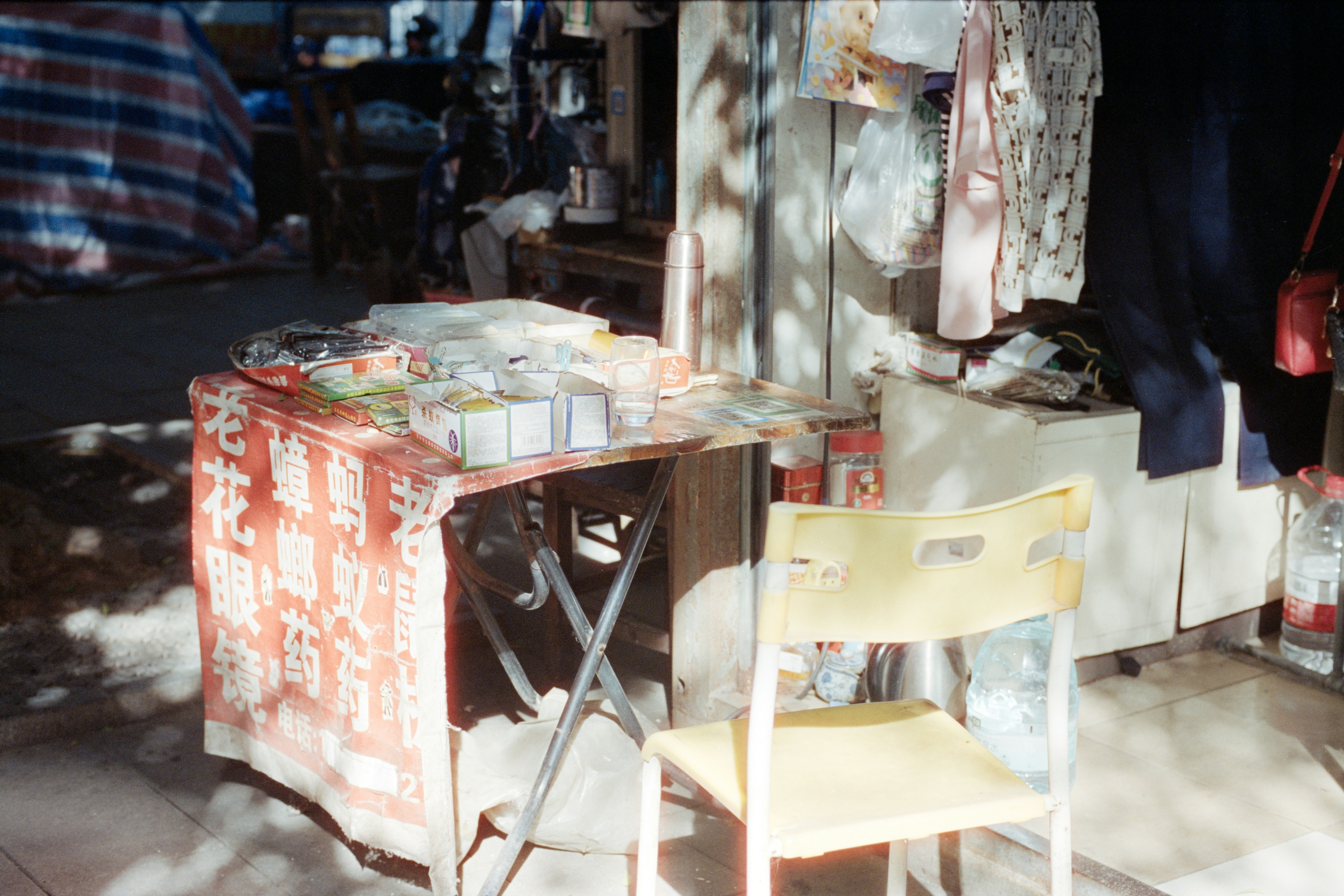A small street stall with items for sale. photo – Free Street ...