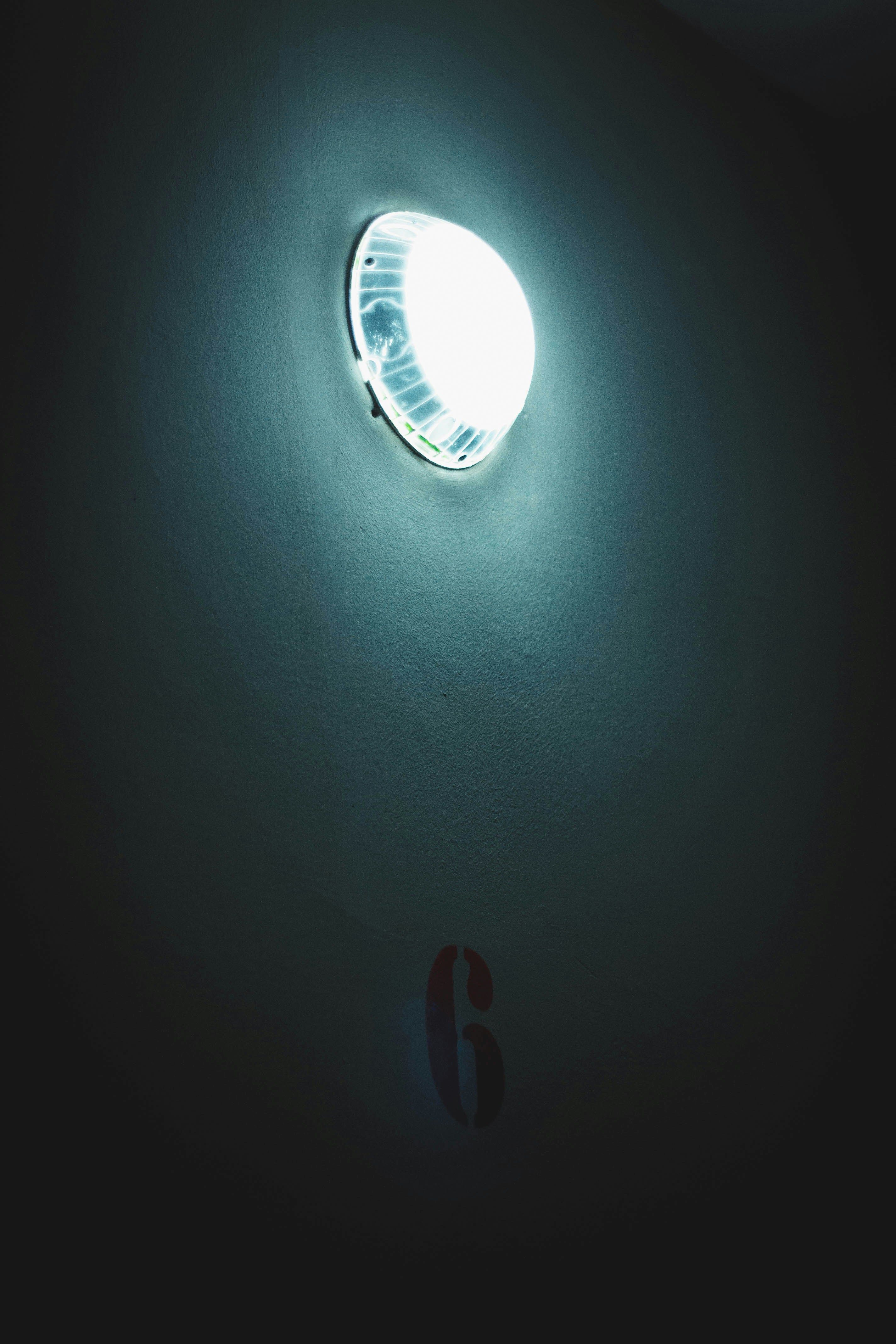 A bright light shines above the number six.