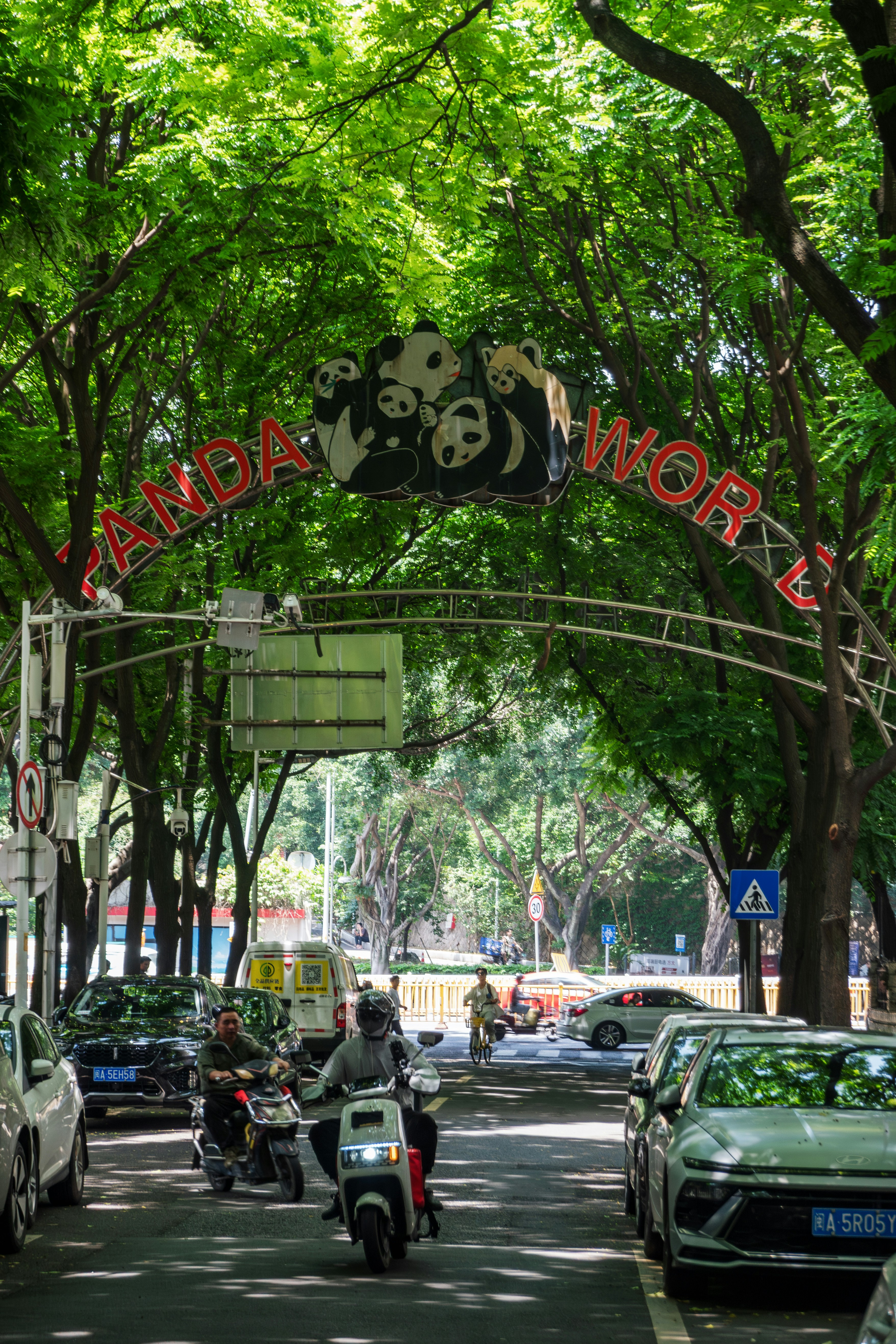 Panda world entrance is shown over a busy road.