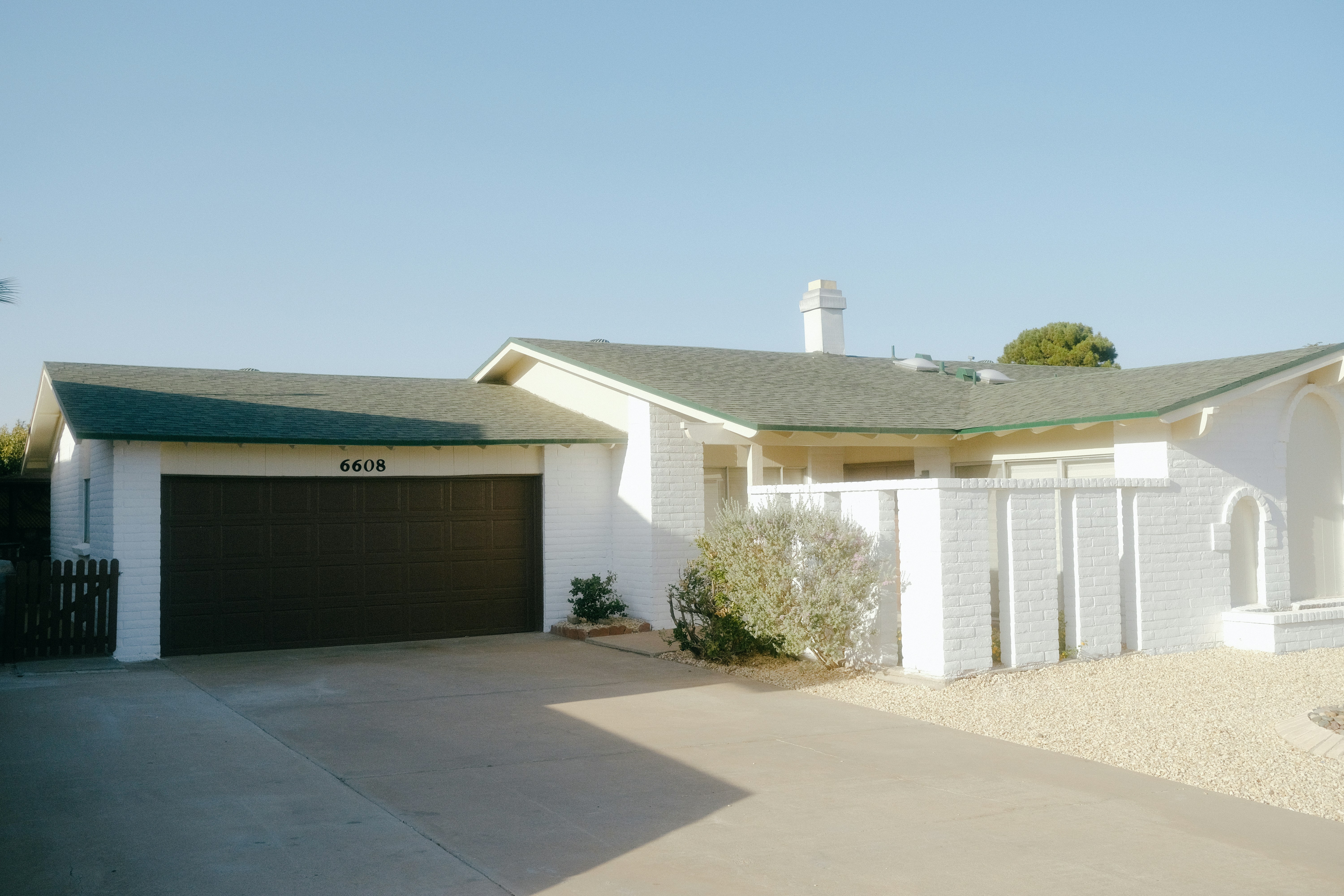 Somewhere in EL PASO, Texas!!! | A bright white house with attached garage.