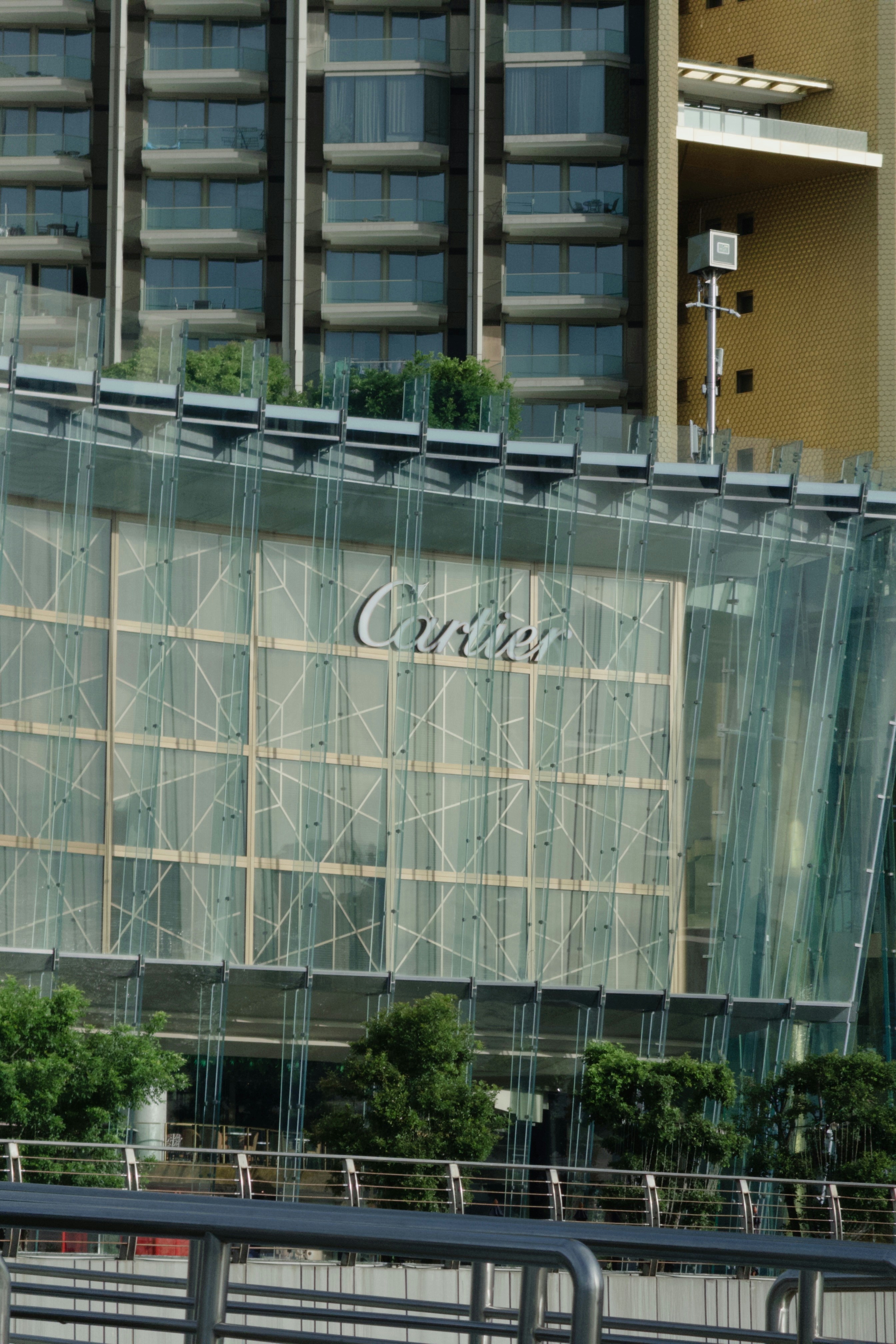 The cartier store is seen on a modern building. photo – Free City Image ...