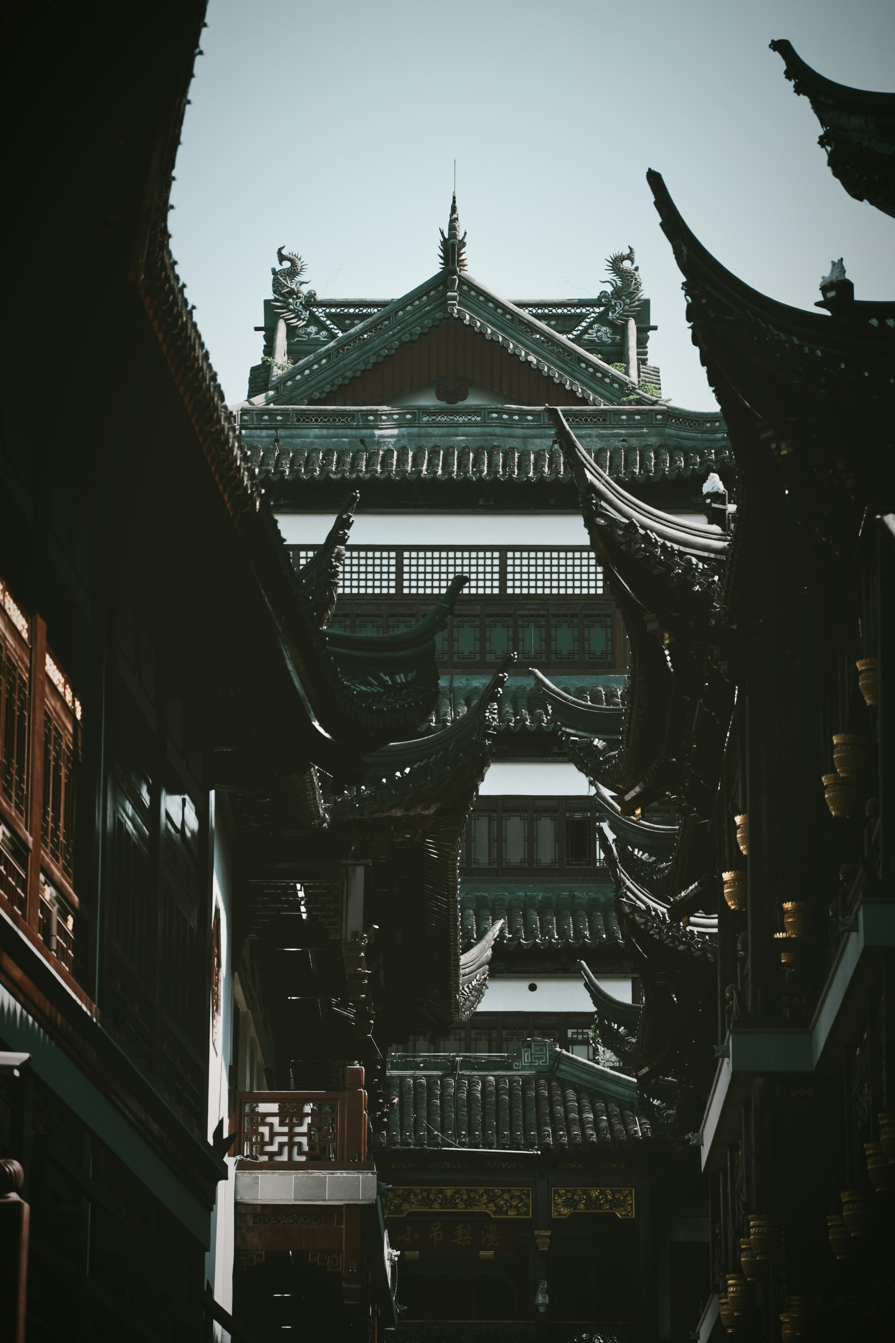 Framed Peaks: The Central Pagoda Rising Over a Corridor of Curved Rooflines